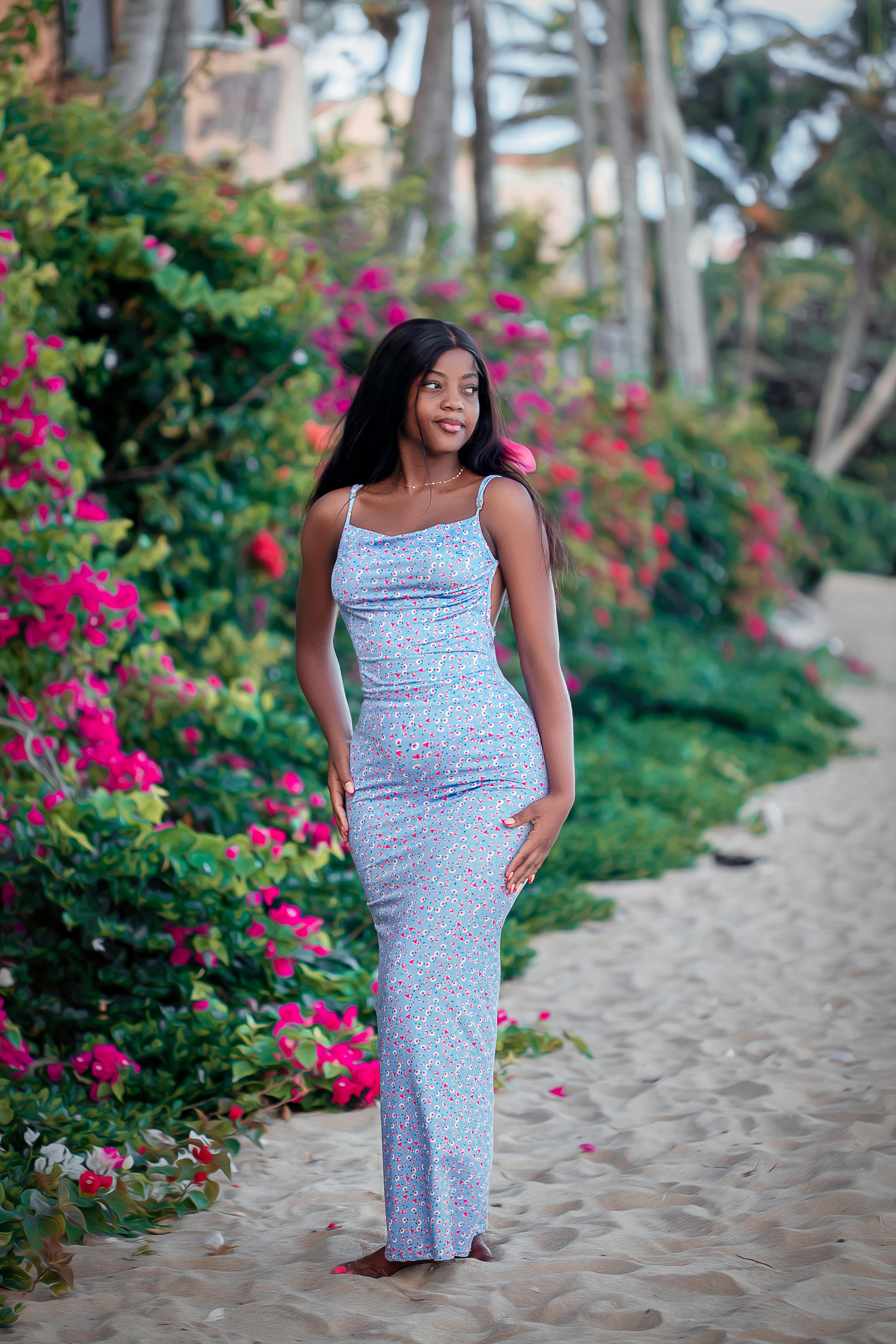 Elegant Woman in Floral Dress on Maputo Beach · Free Stock Photo