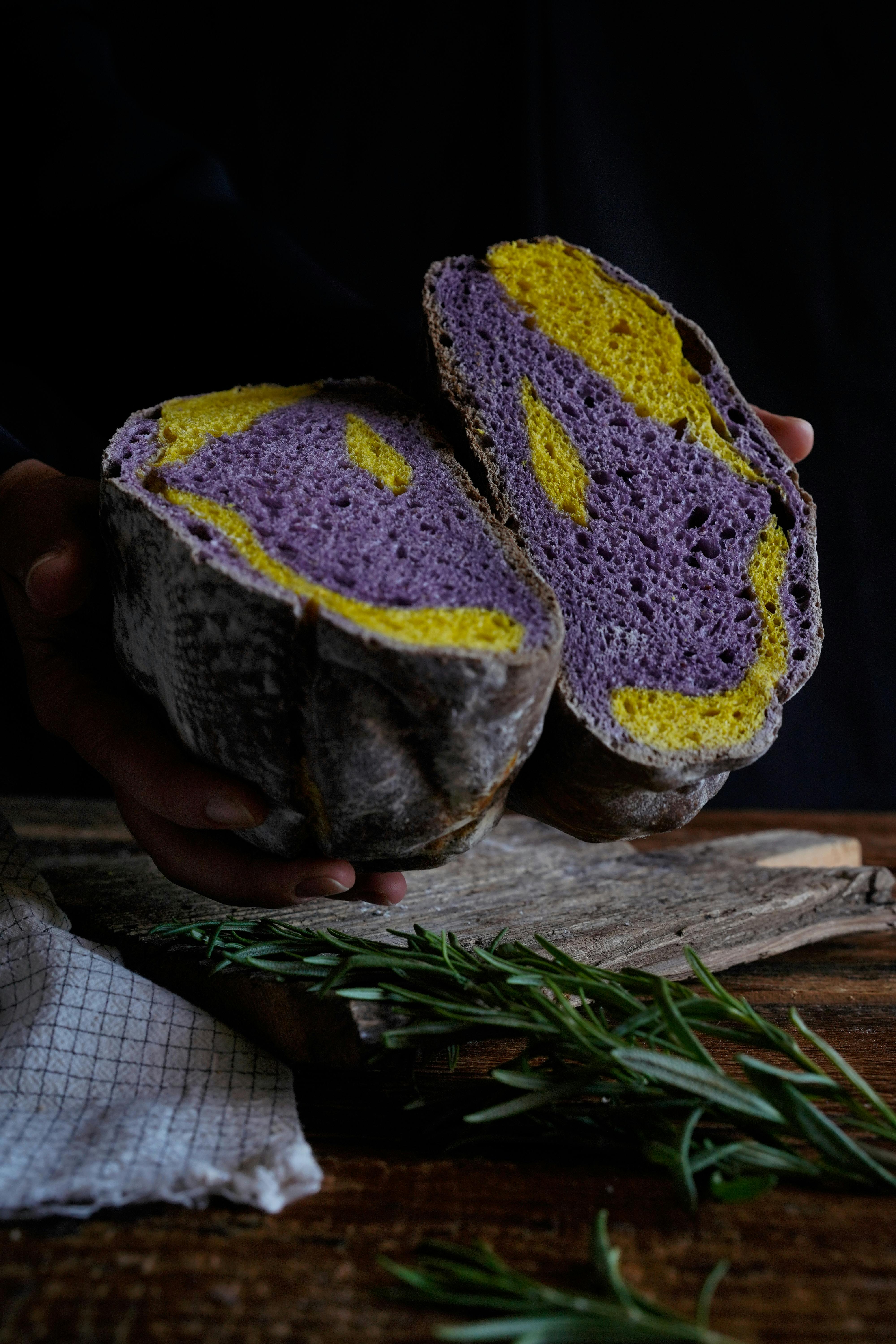 Colorful Artisan Bread on Rustic Wooden Board · Free Stock Photo