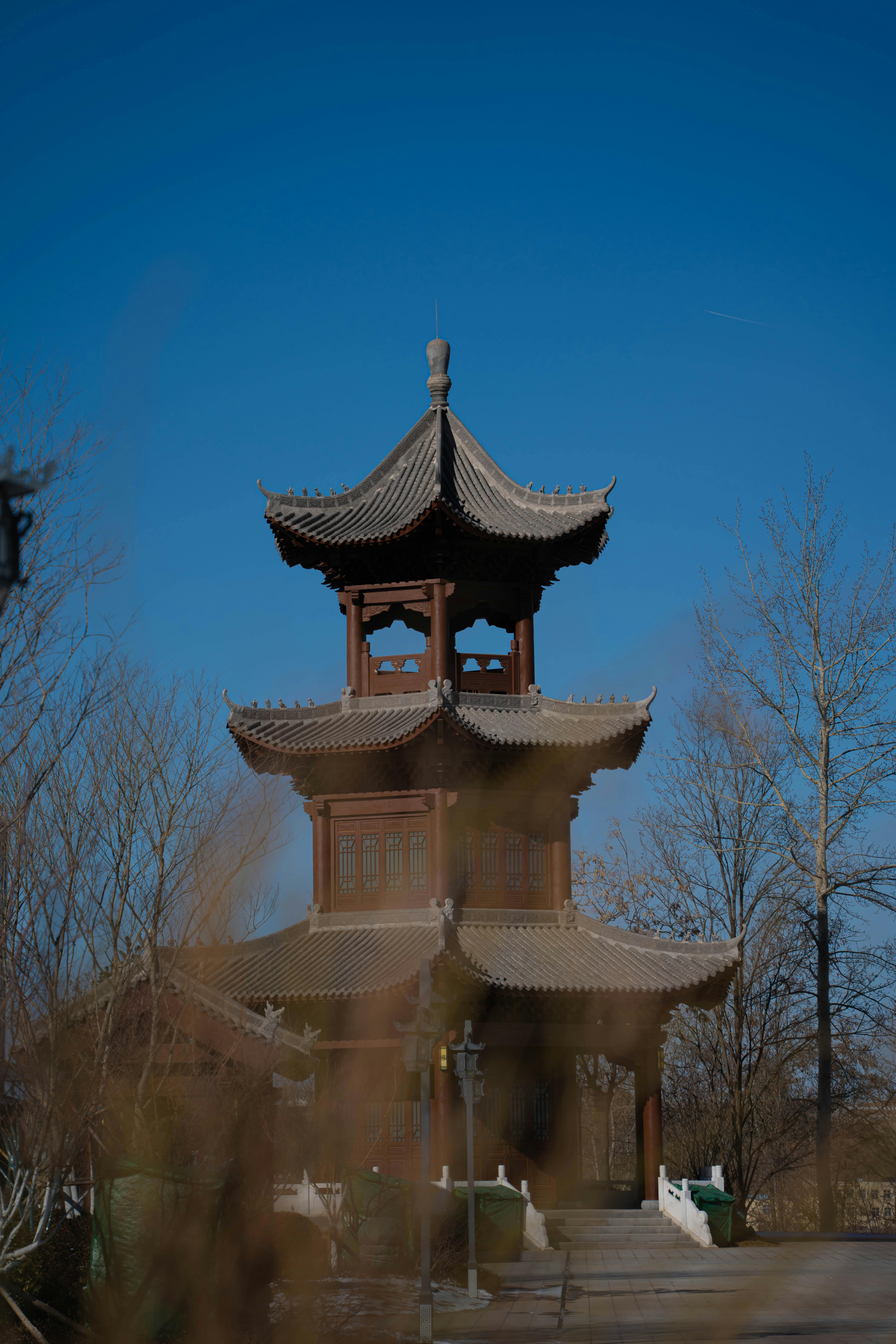 Traditional Chinese Pagoda in Sunny Park Setting · Free Stock Photo