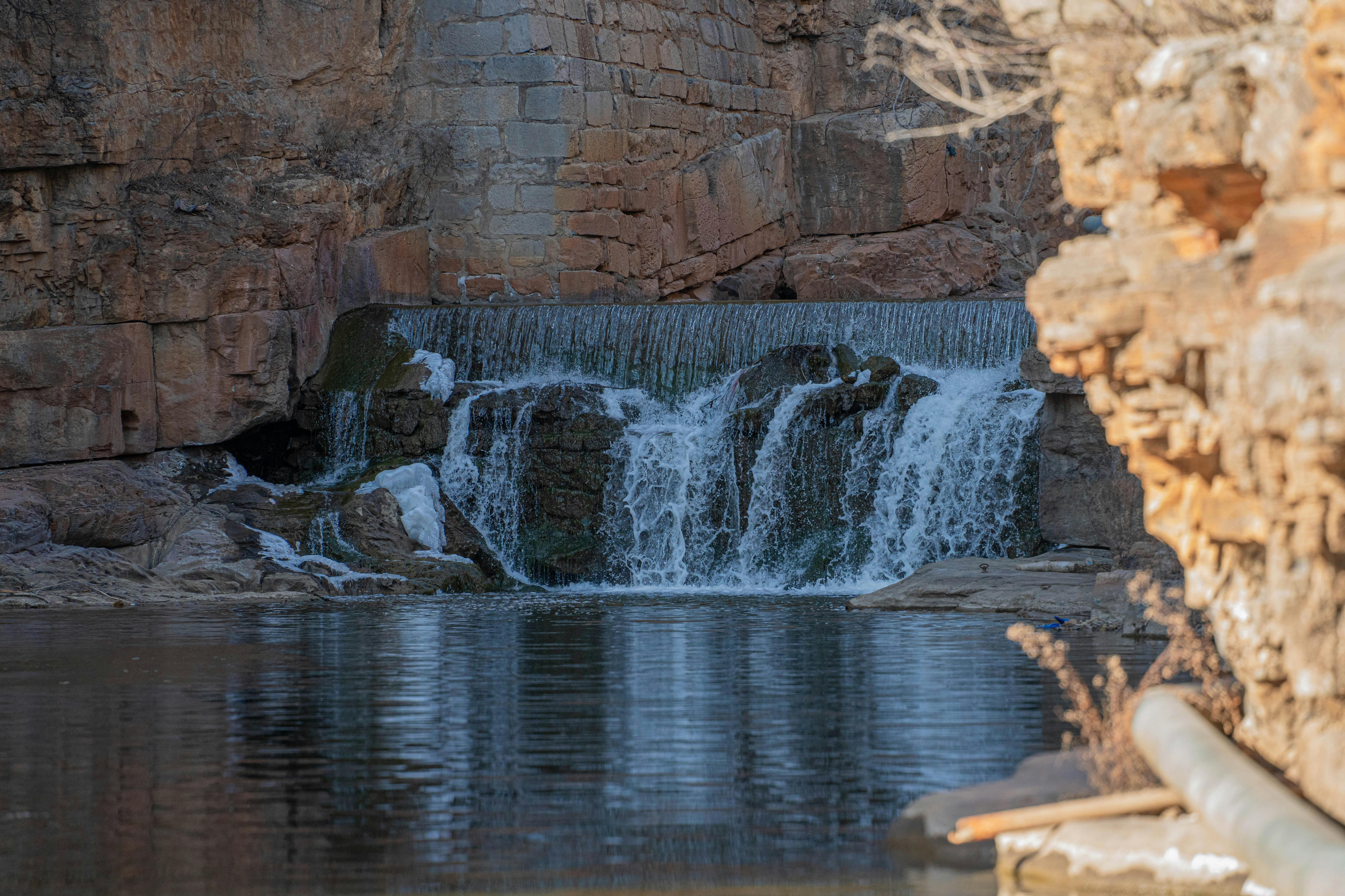 Tranquil Waterfall in Rocky Landscape · Free Stock Photo