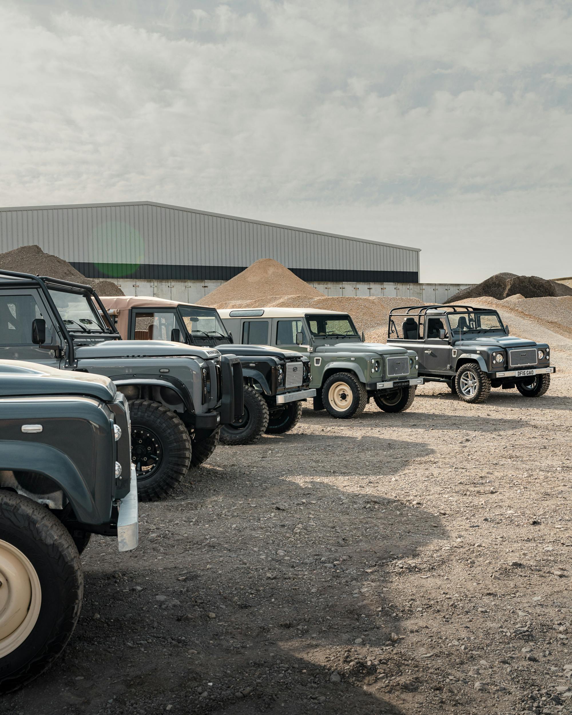 Lineup of Vintage Off-Road Vehicles in Industrial Setting · Free Stock ...