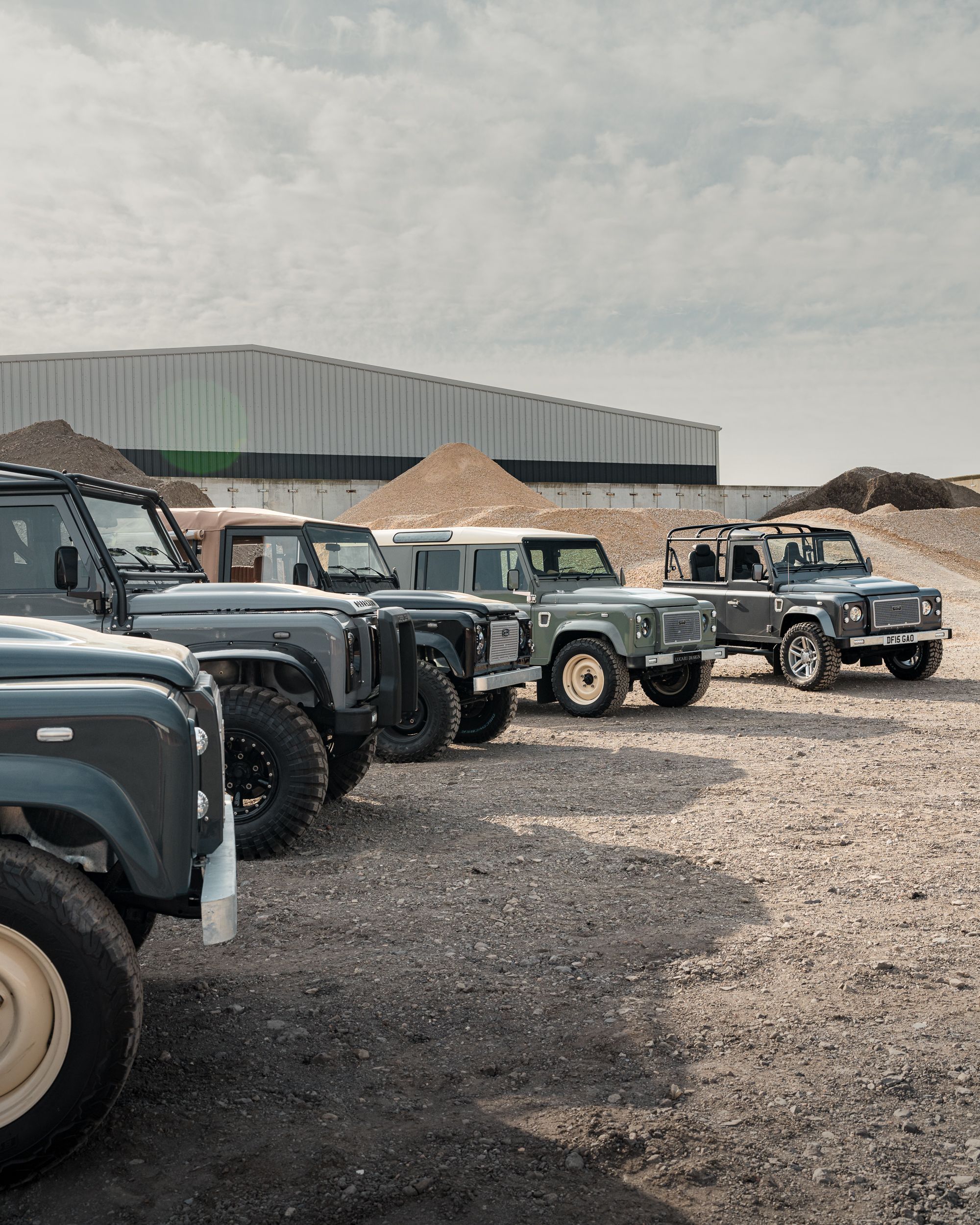 Lineup of Vintage Off-Road Vehicles in Industrial Setting · Free Stock ...