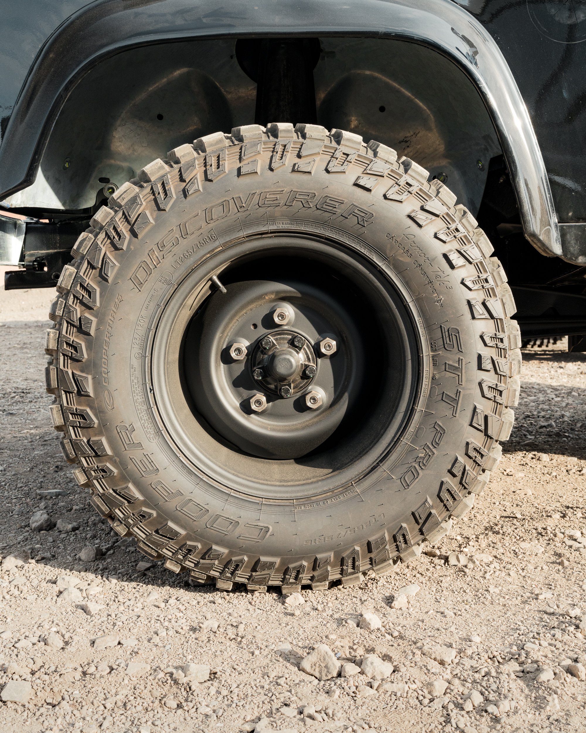 Close-Up of Off-Road Vehicle Tire on Rocky Terrain · Free Stock Photo