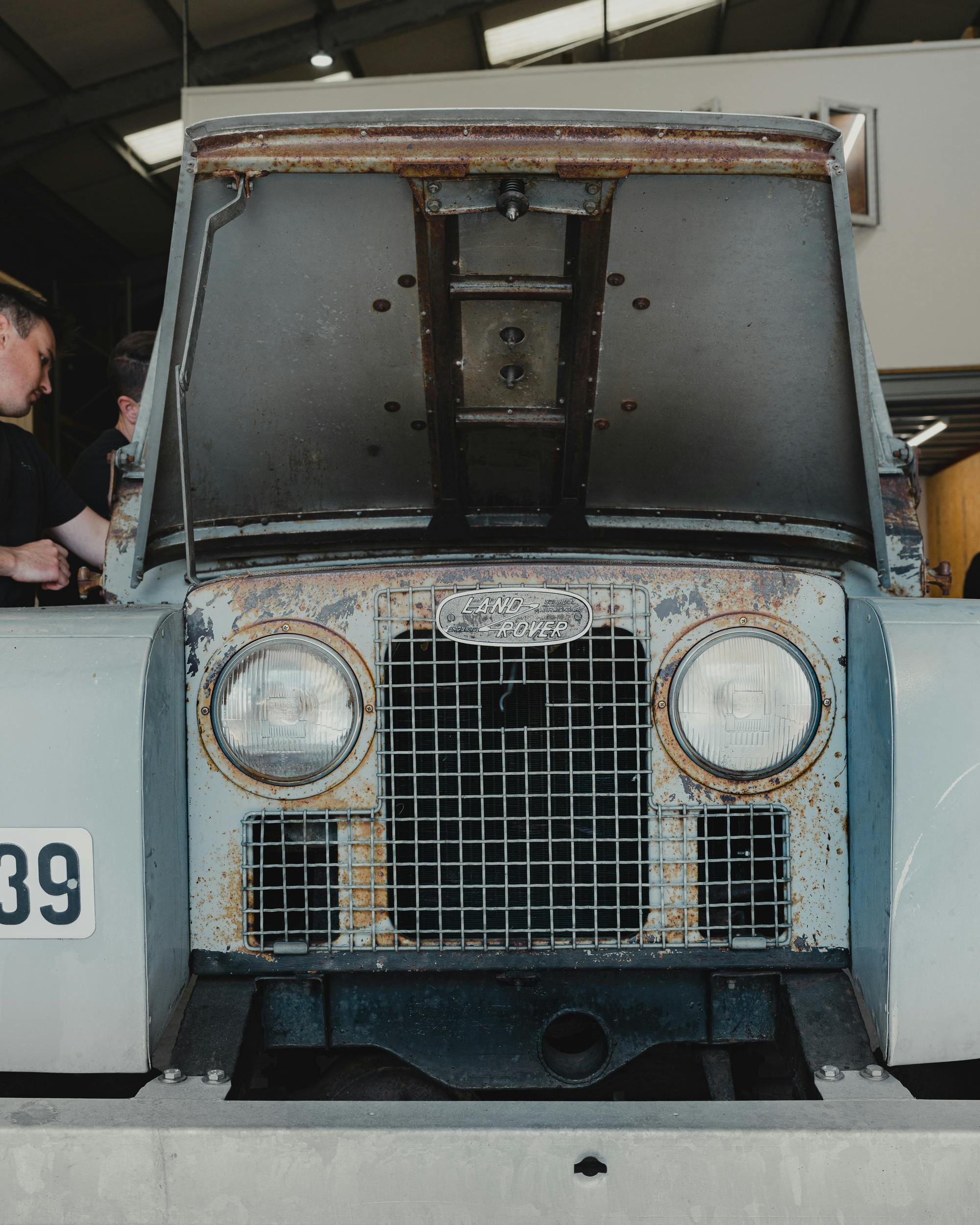 Rustic Vintage Land Rover in Garage Setting · Free Stock Photo