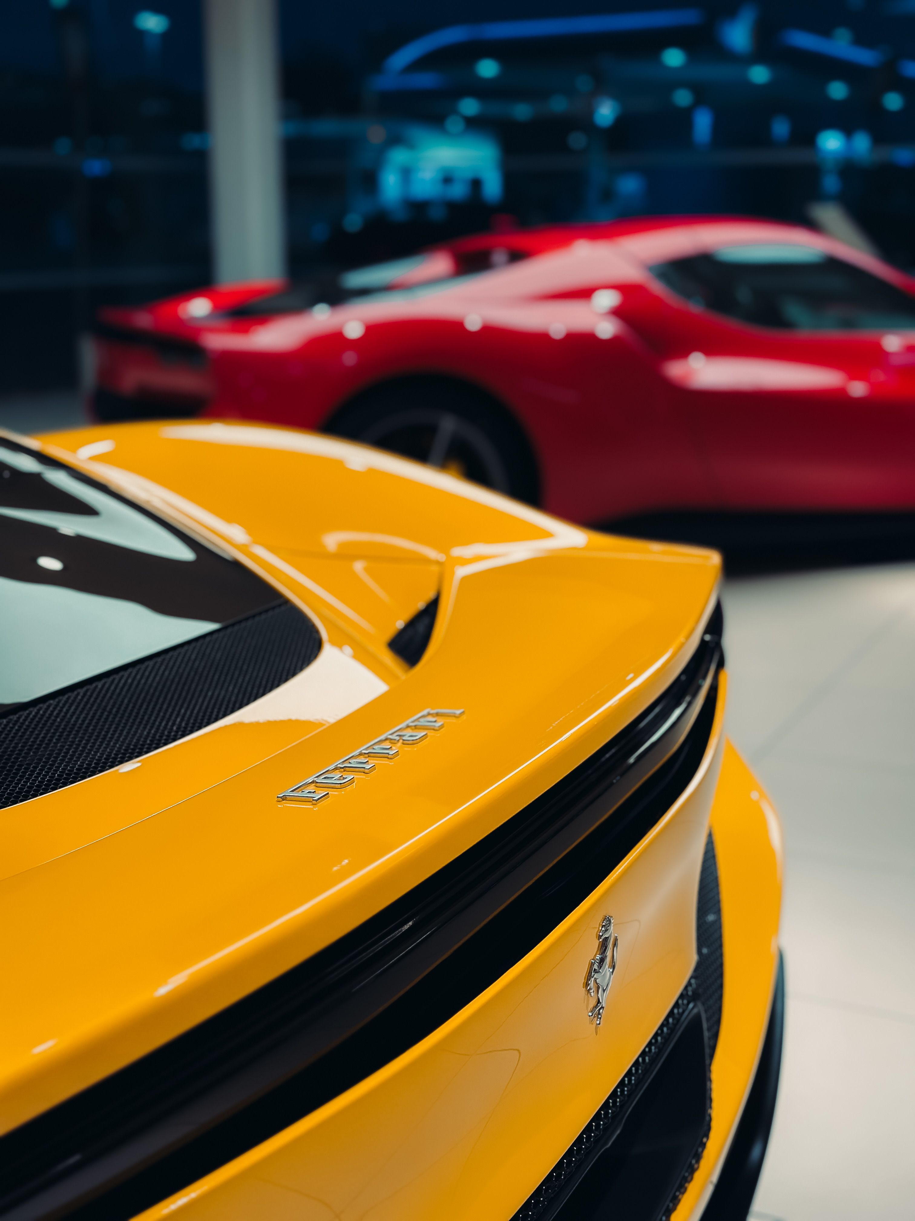 Sleek Supercars on Display in Showroom Setting · Free Stock Photo