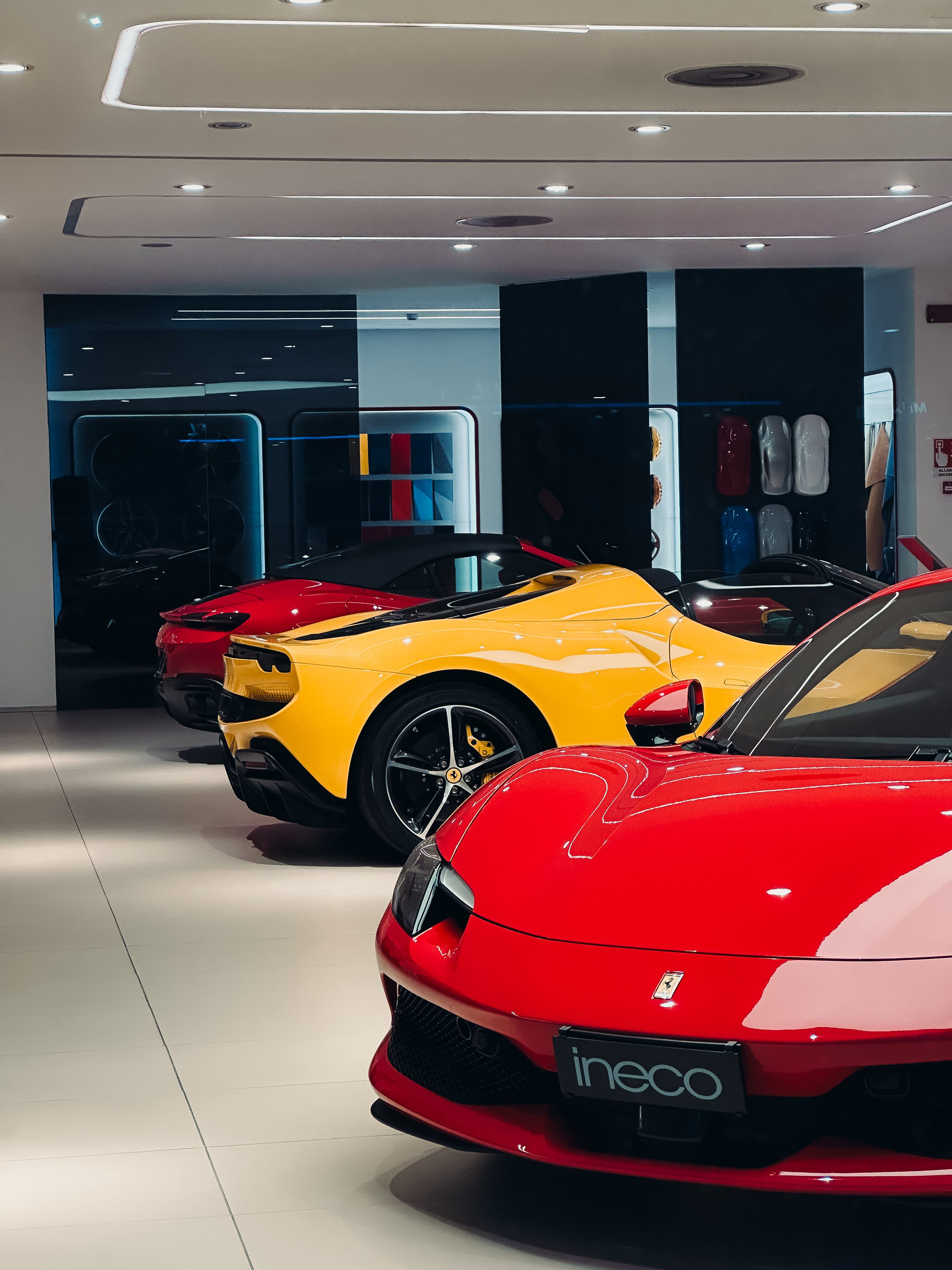 Luxury Sports Cars in Showroom Display · Free Stock Photo