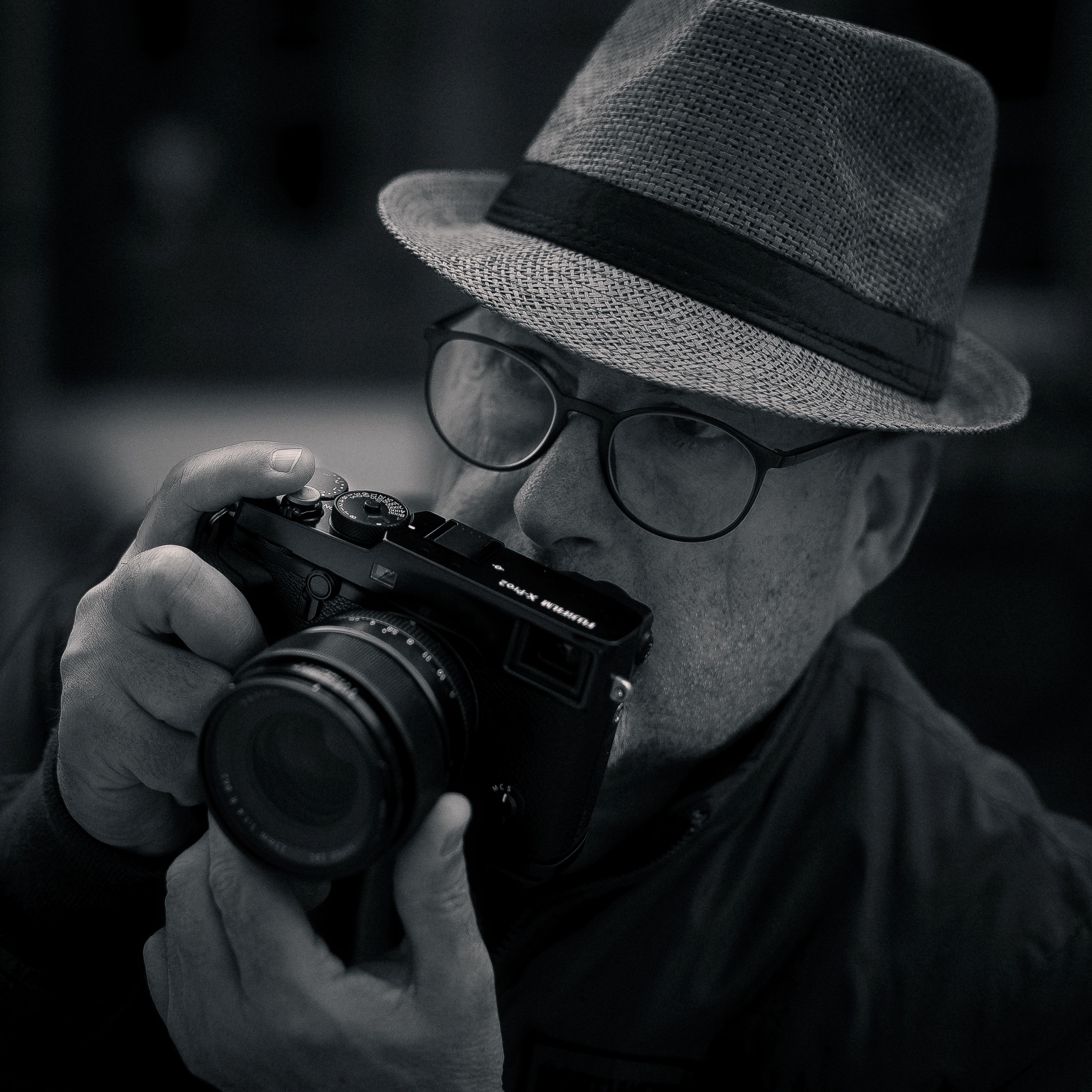 Vintage Style Portrait of Photographer with Camera · Free Stock Photo