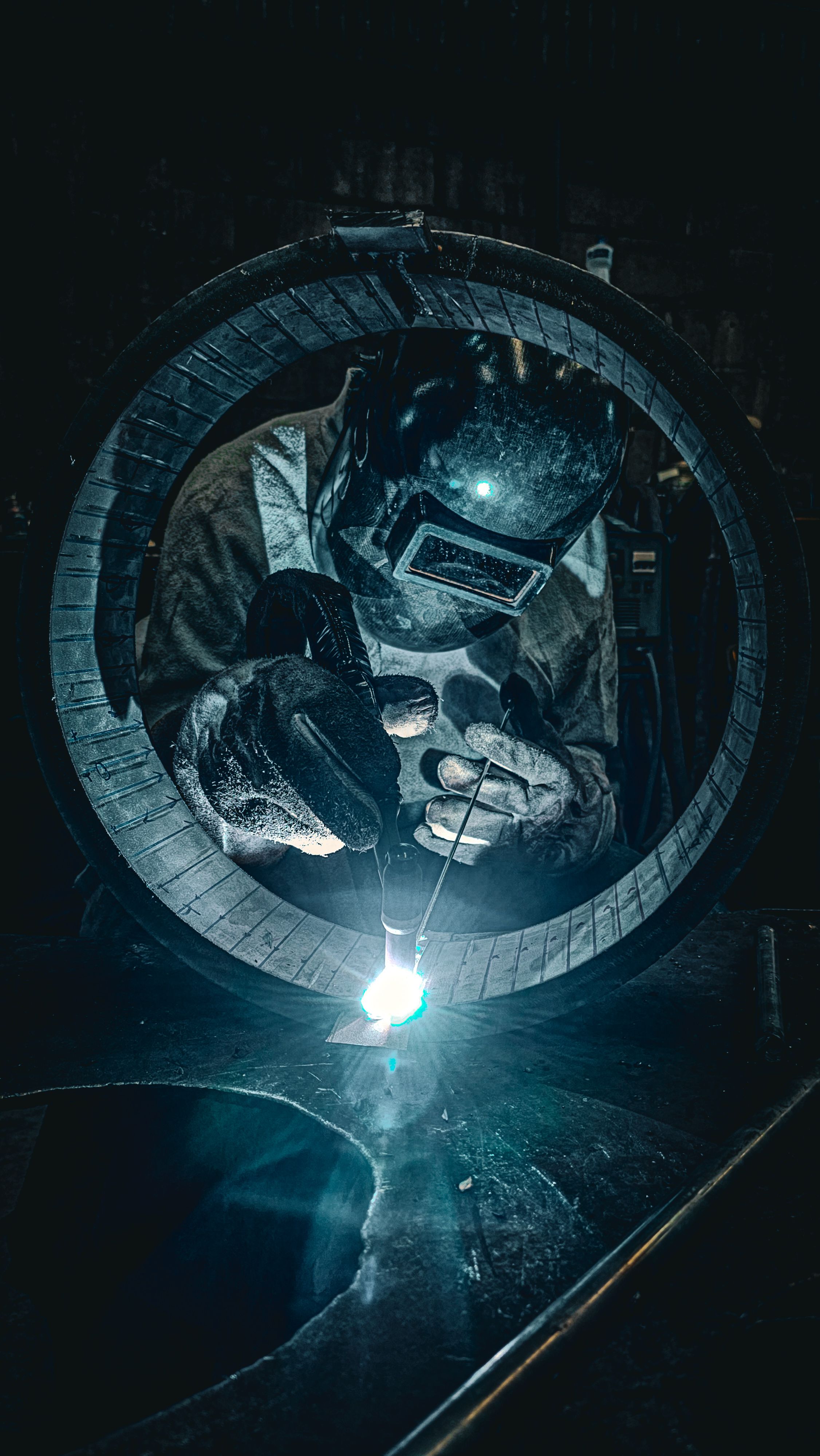 Person in Welding Mask While Welding a Metal Bar · Free Stock Photo