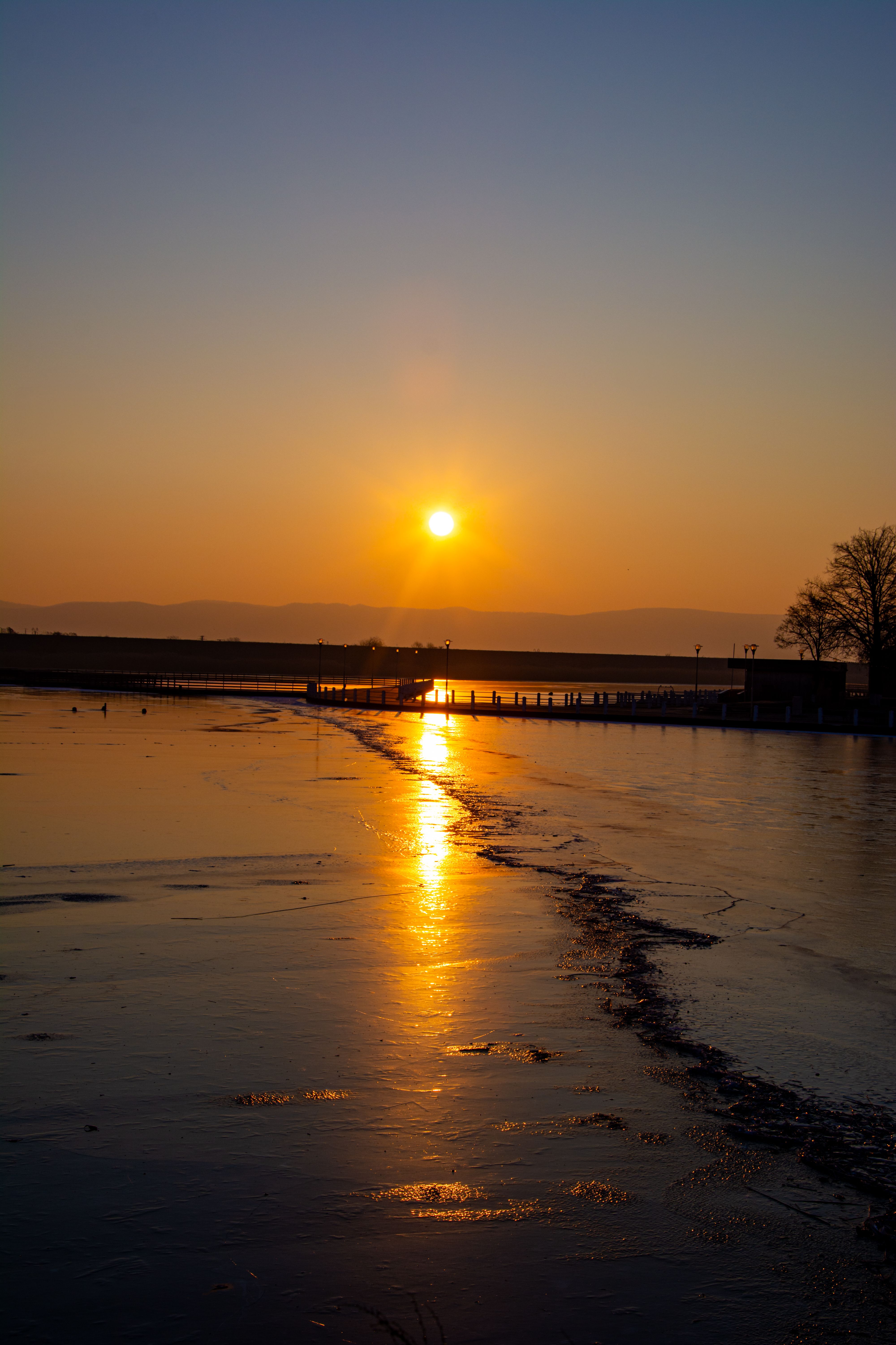 Golden Sunset Over a Frozen Lake · Free Stock Photo