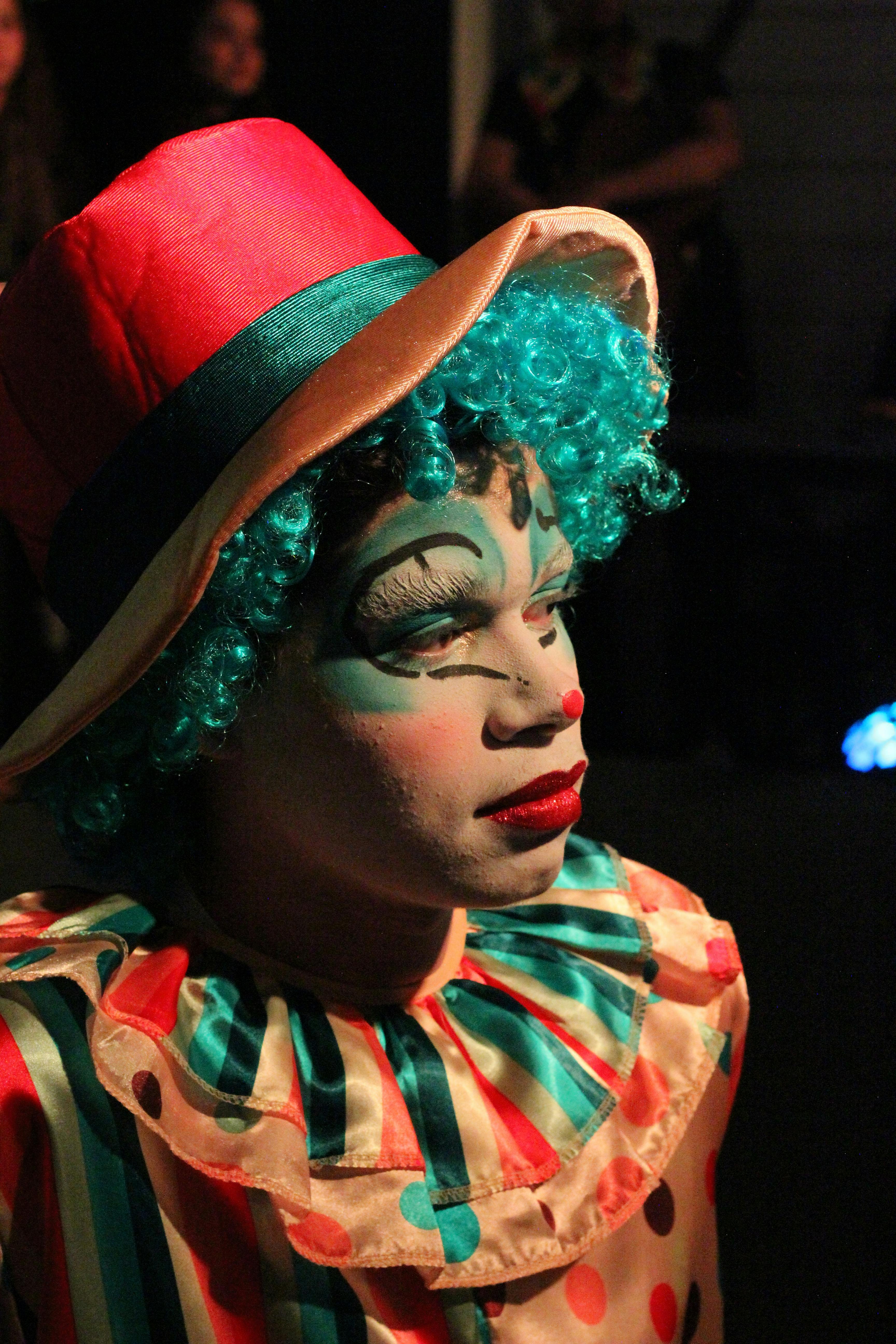 Colorful Clown Portrait in Dramatic Lighting · Free Stock Photo