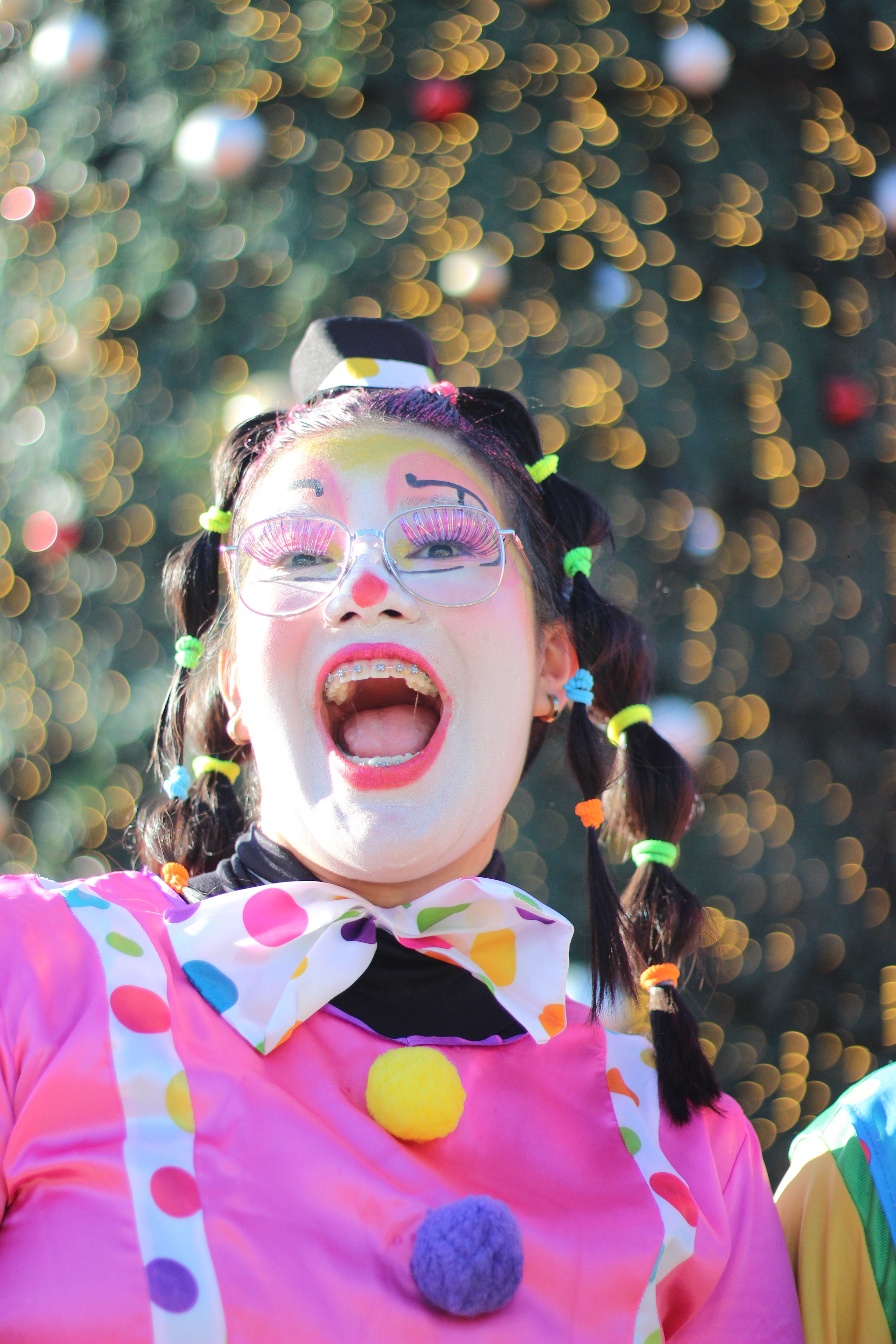Colorful Clown Entertainer with Big Smile Outdoors · Free Stock Photo