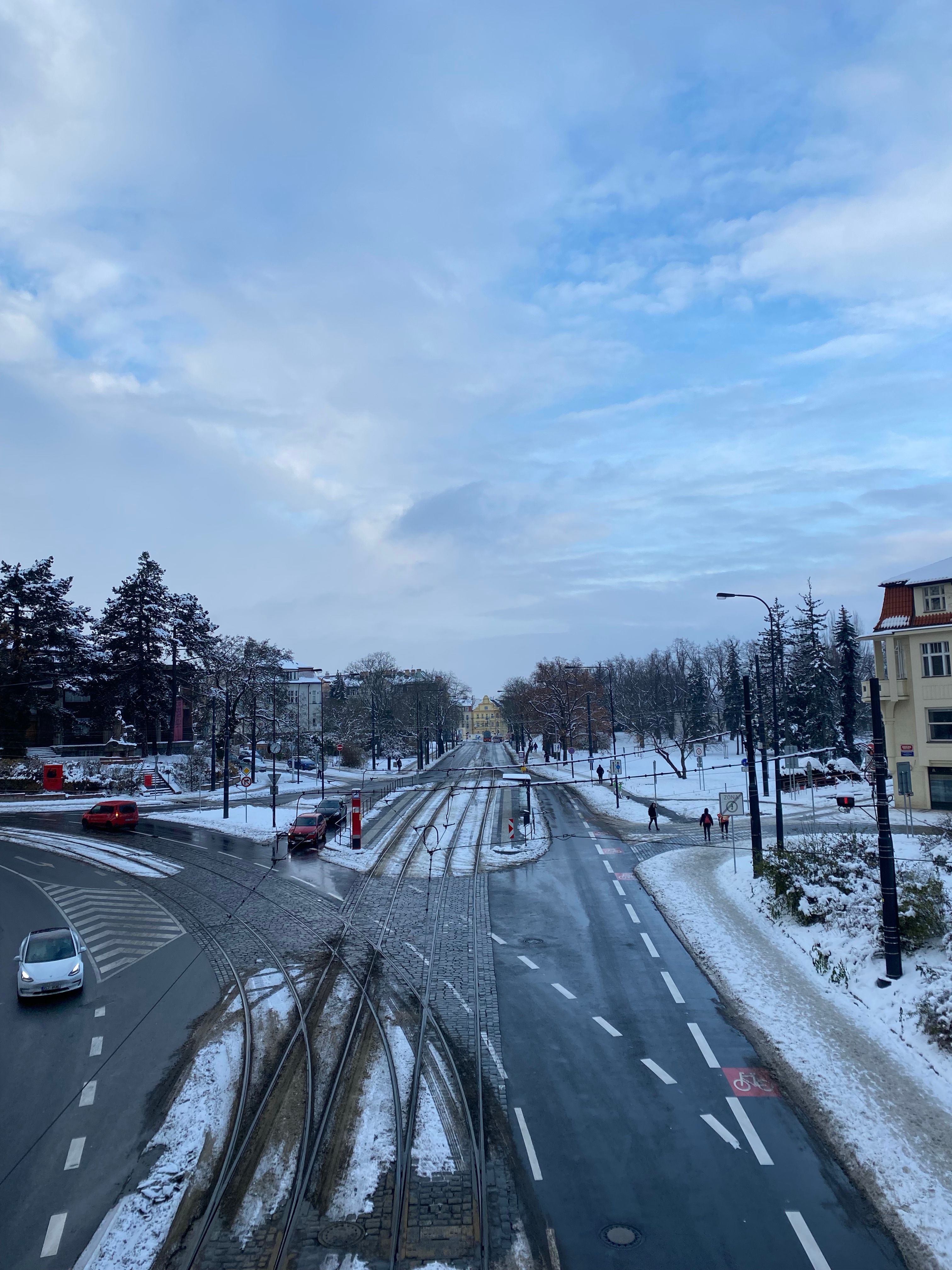 Snowy Urban Intersection with Tram Tracks in Winter · Free Stock Photo