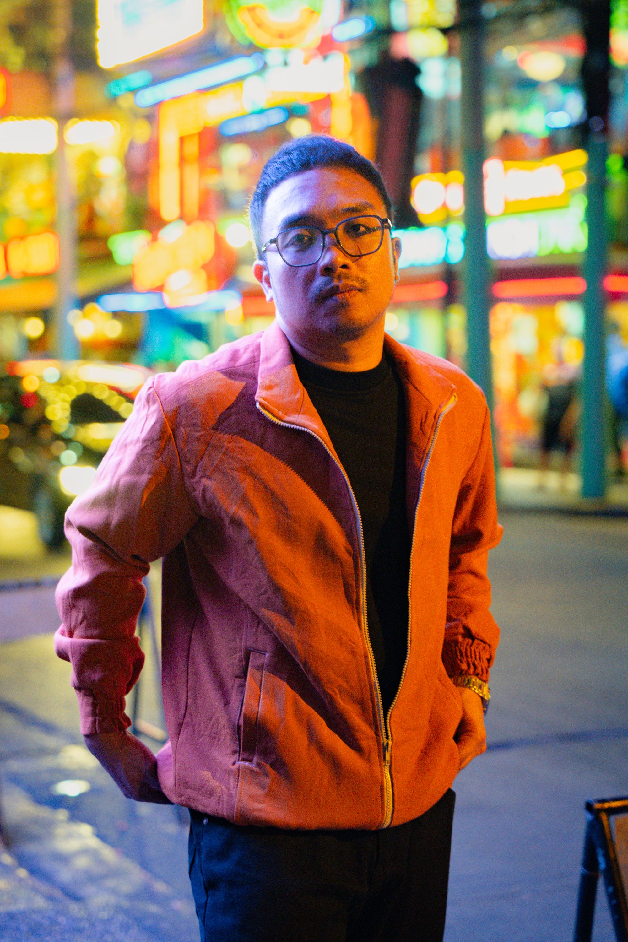 Man in Urban Nightscape with Neon Lights · Free Stock Photo