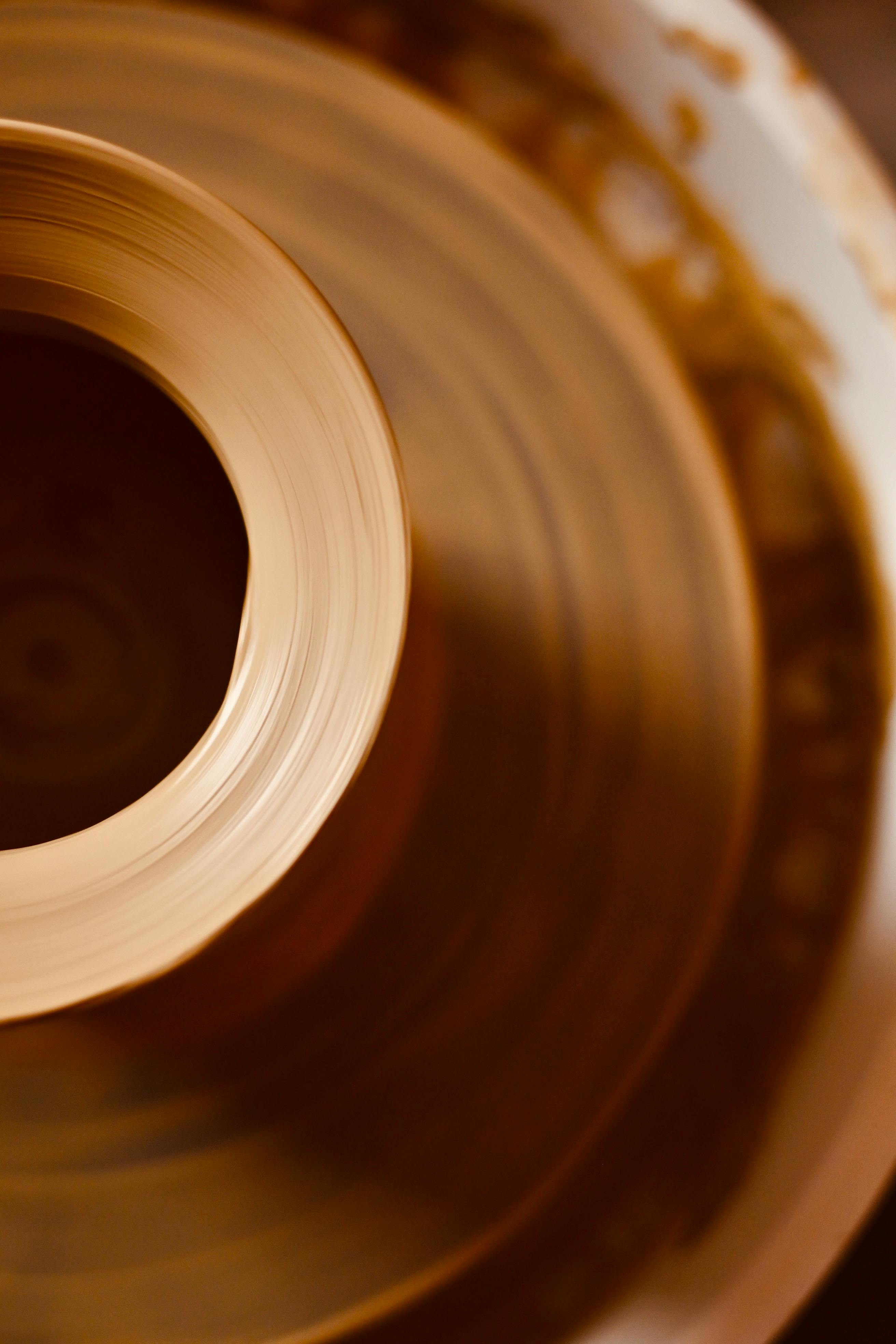 Close-Up of Clay Spinning on a Pottery Wheel · Free Stock Photo