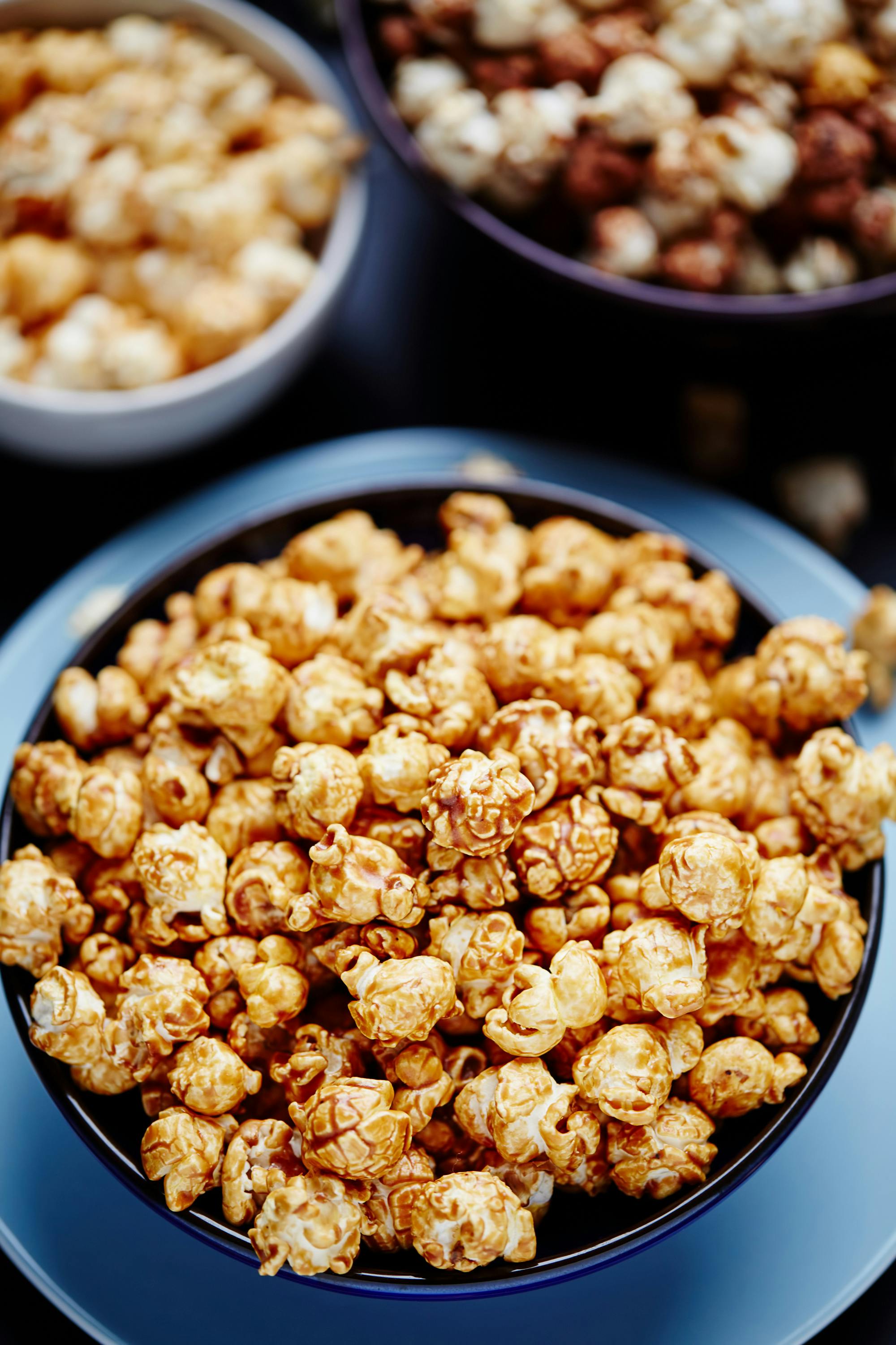Assorted Flavored Popcorn in Bowls from Above · Free Stock Photo