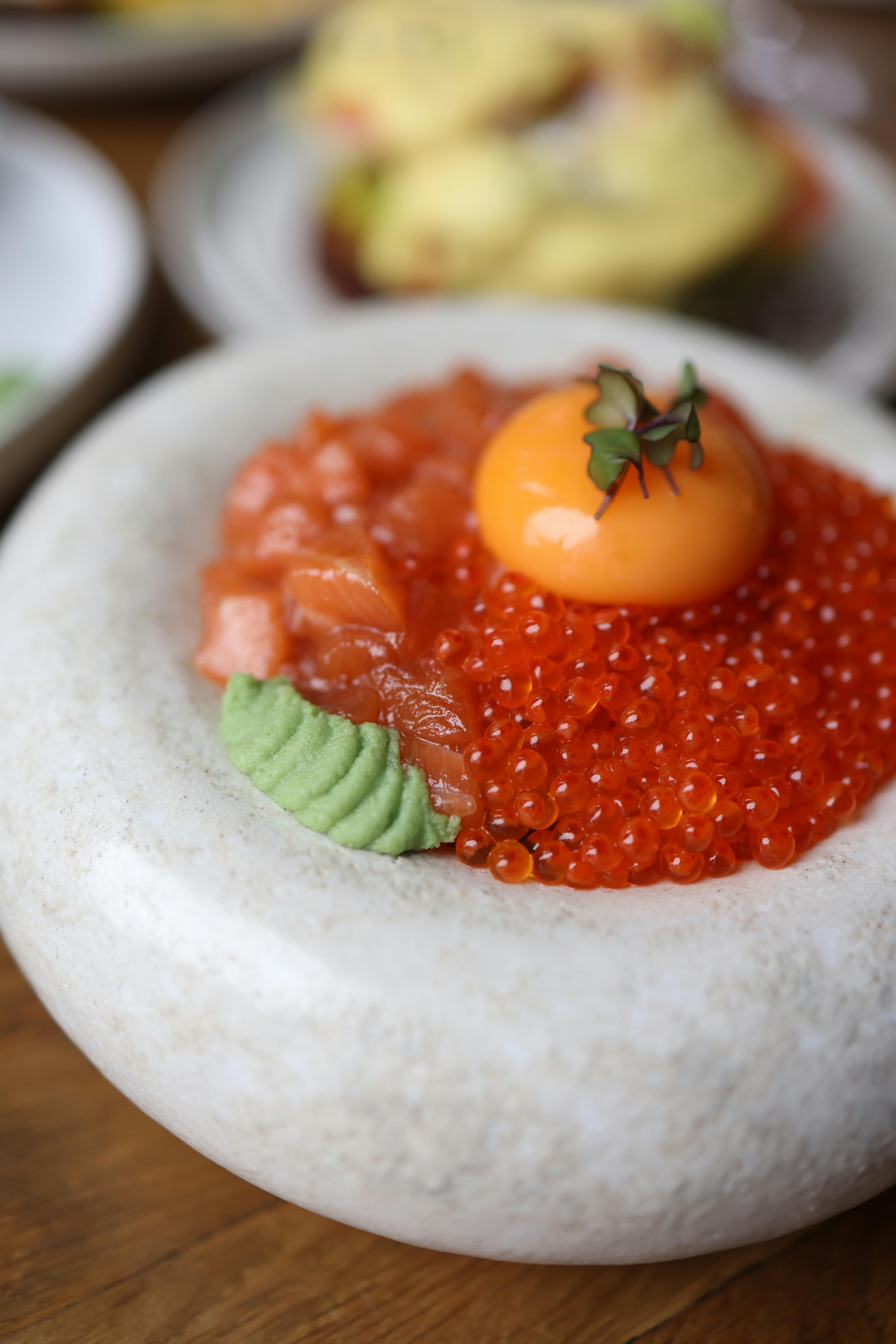 Exquisite Salmon Roe and Wasabi Dish on Stone Plate · Free Stock Photo