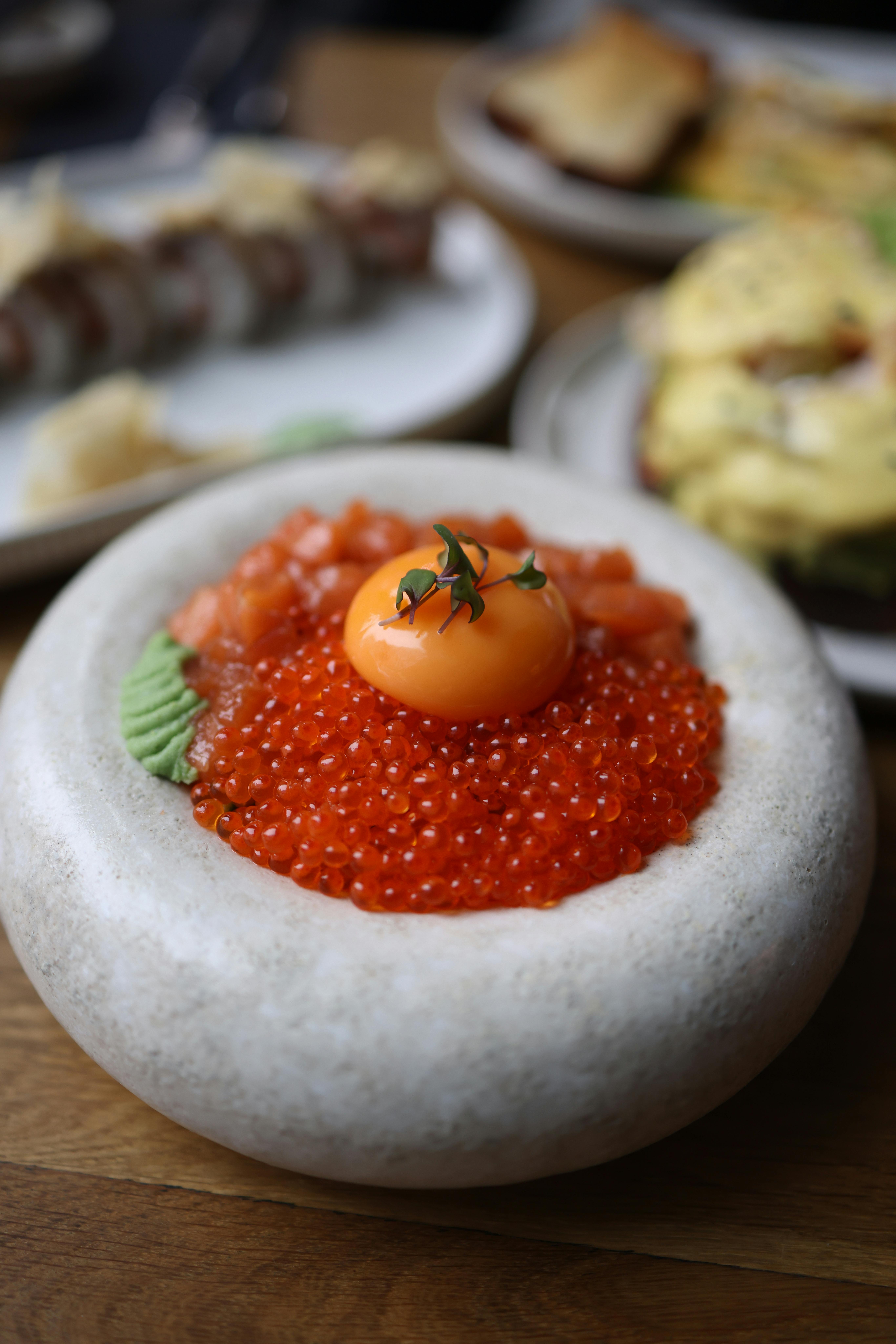 Gourmet Salmon Roe Dish with Egg Yolk Garnish · Free Stock Photo