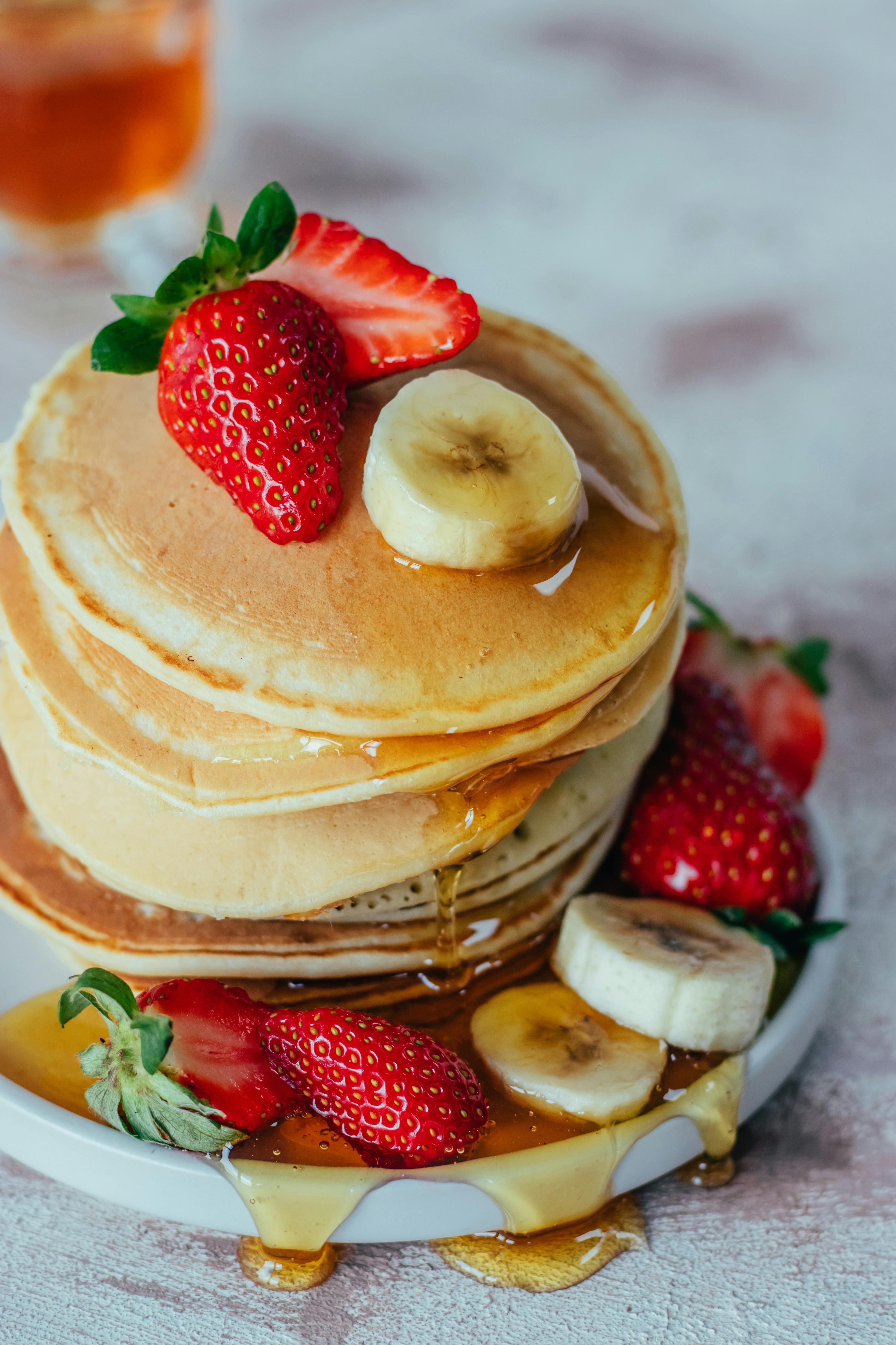 Delicious Pancake Stack with Fresh Fruits and Syrup · Free Stock Photo