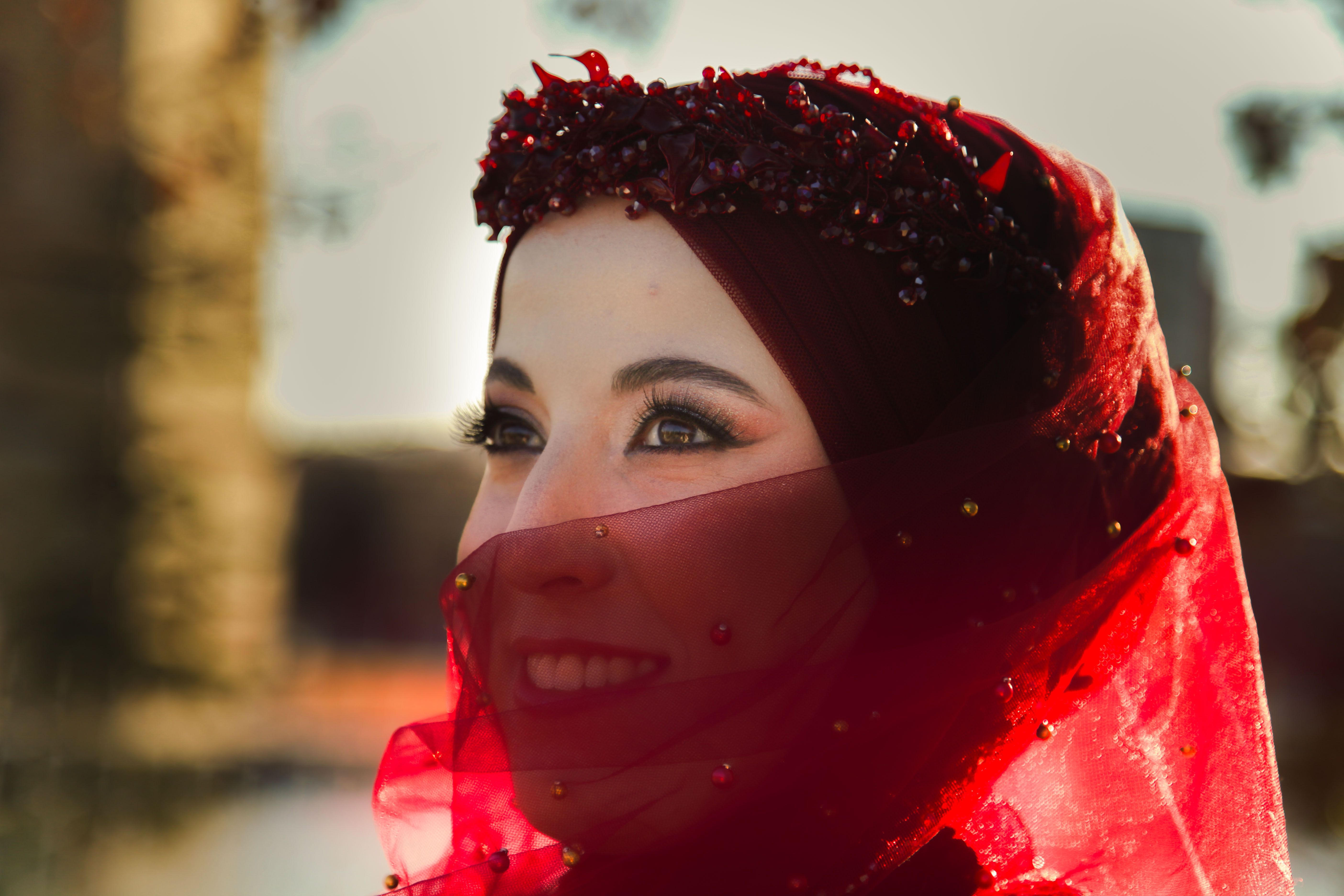 Portrait of Woman in Red Veil with Beaded Crown · Free Stock Photo