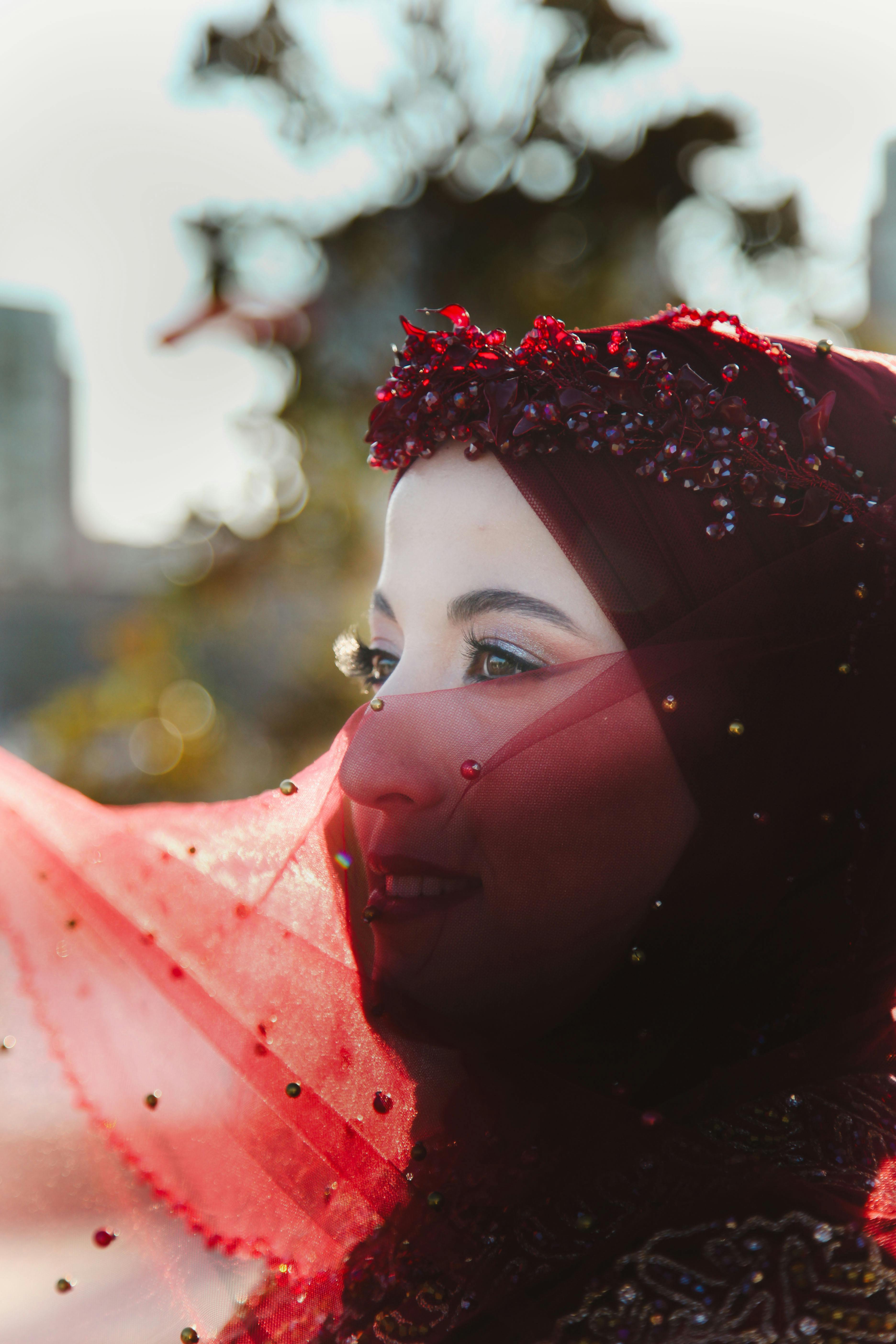 Elegant Woman in Red Veil with Urban Background · Free Stock Photo