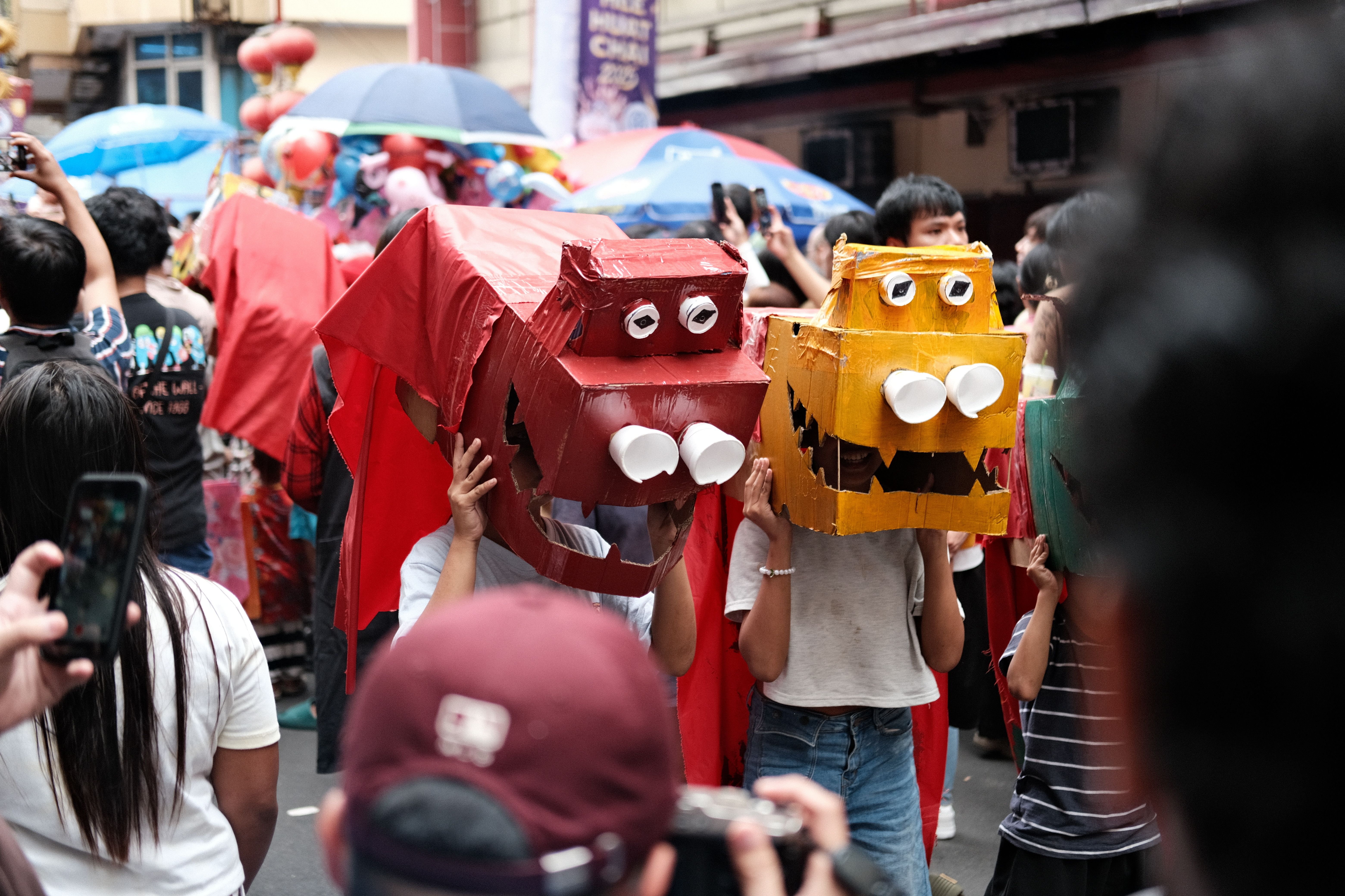 Festive Street Parade with Colorful Dragon Costumes · Free Stock Photo