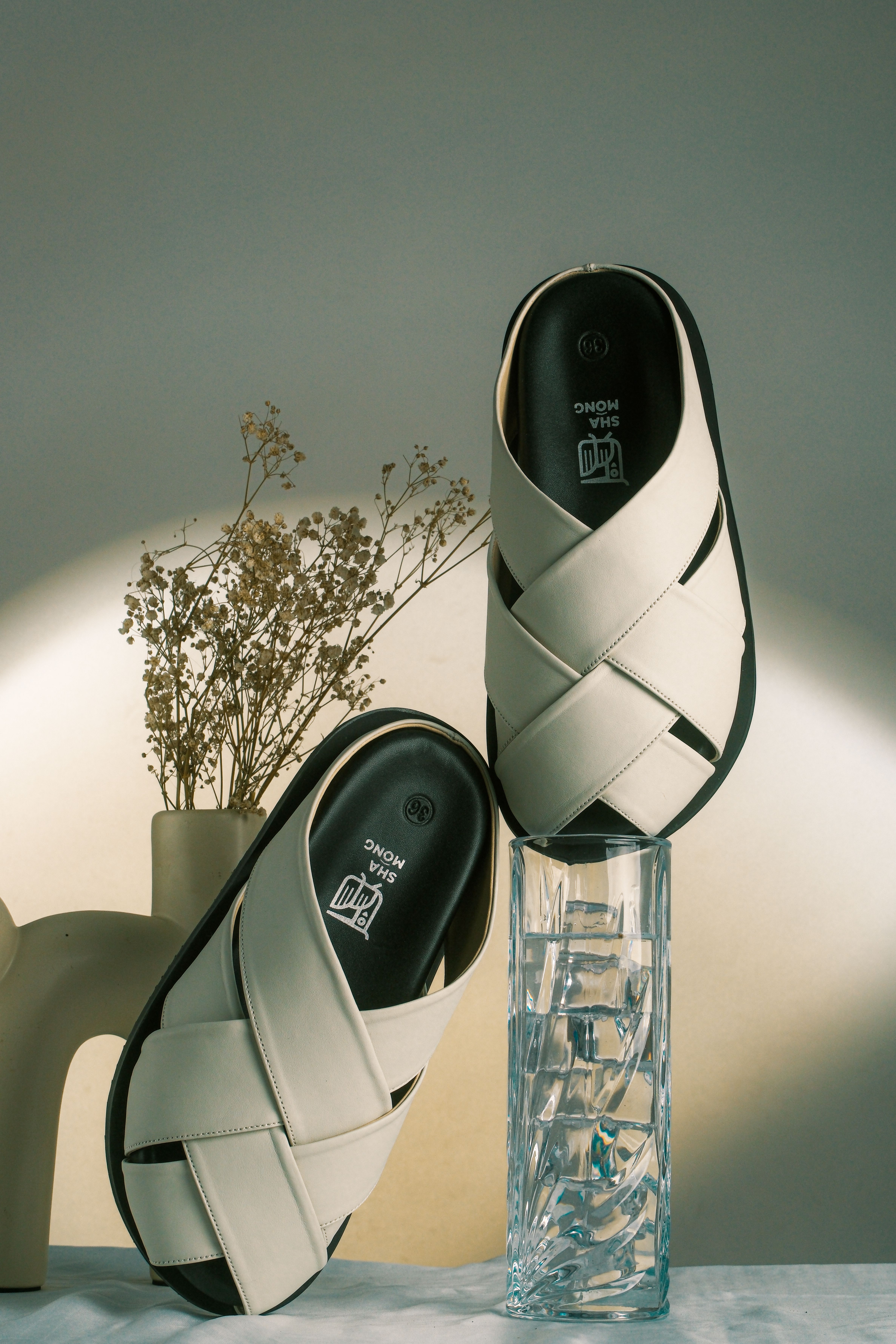 Modern White Sandals on Artistic Display · Free Stock Photo