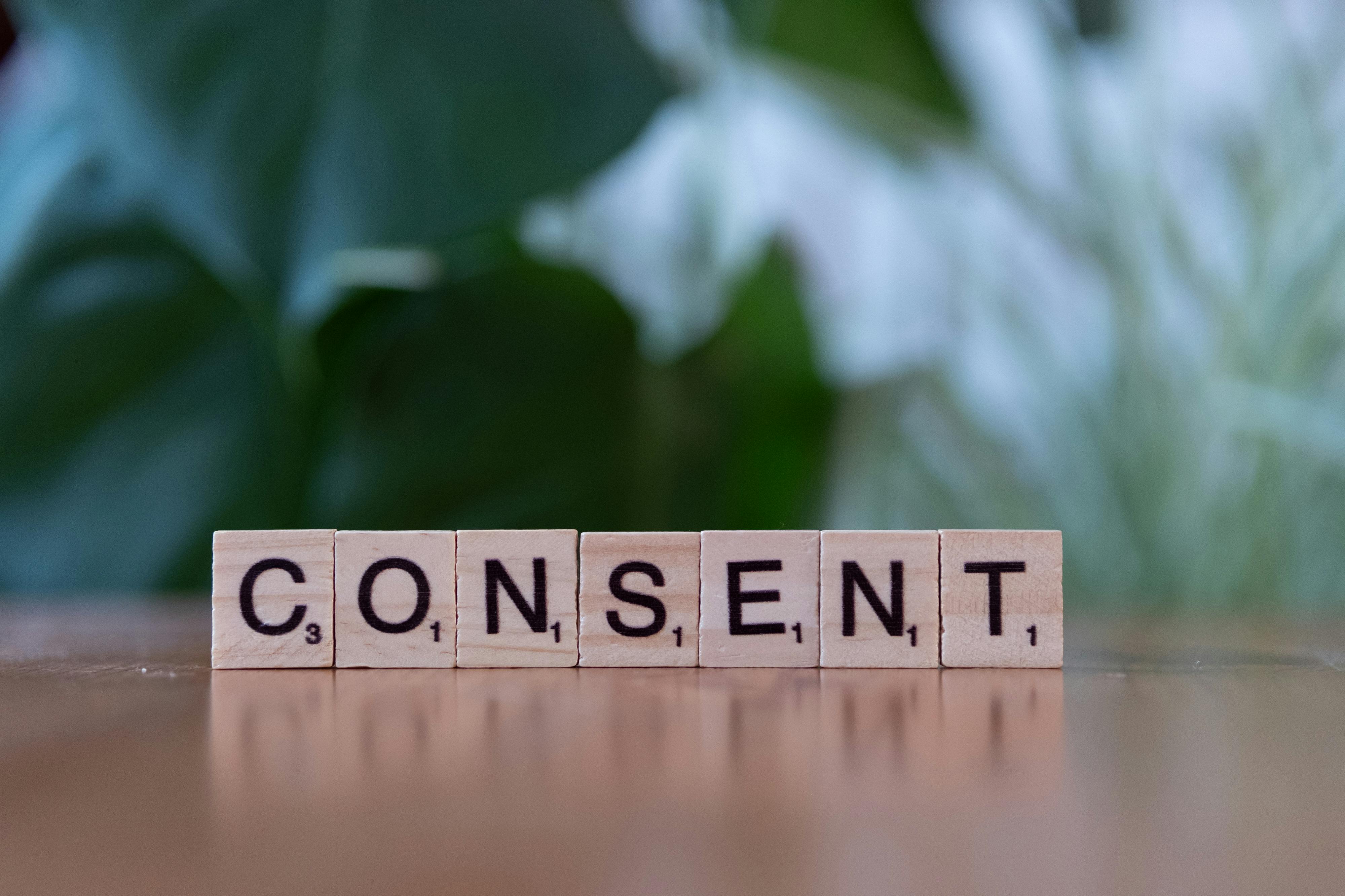 Scrabble Tiles Spelling 'Consent' on a Table · Free Stock Photo