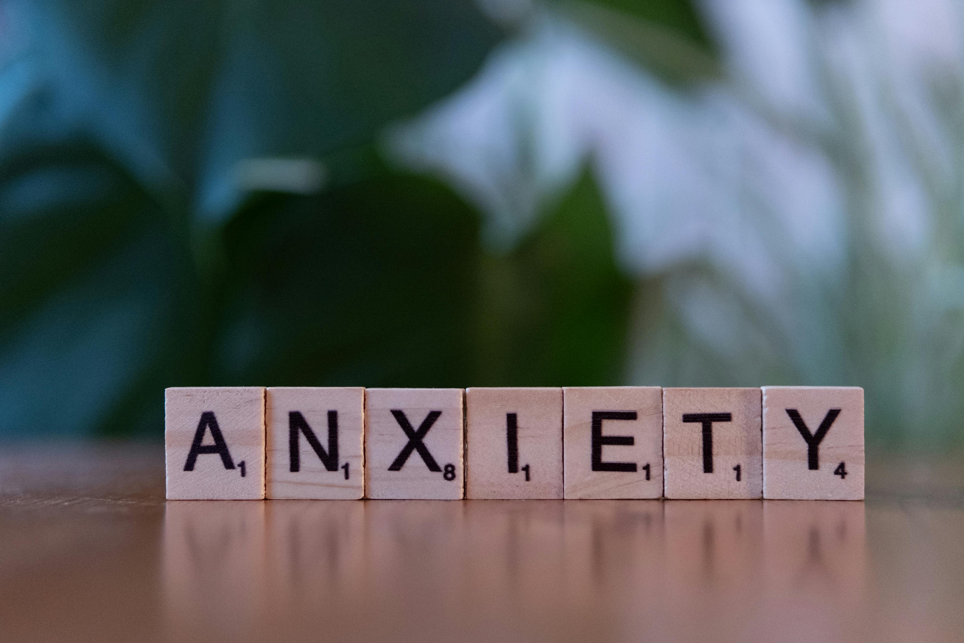 Wooden Blocks Spelling Anxiety on Wooden Surface · Free Stock Photo