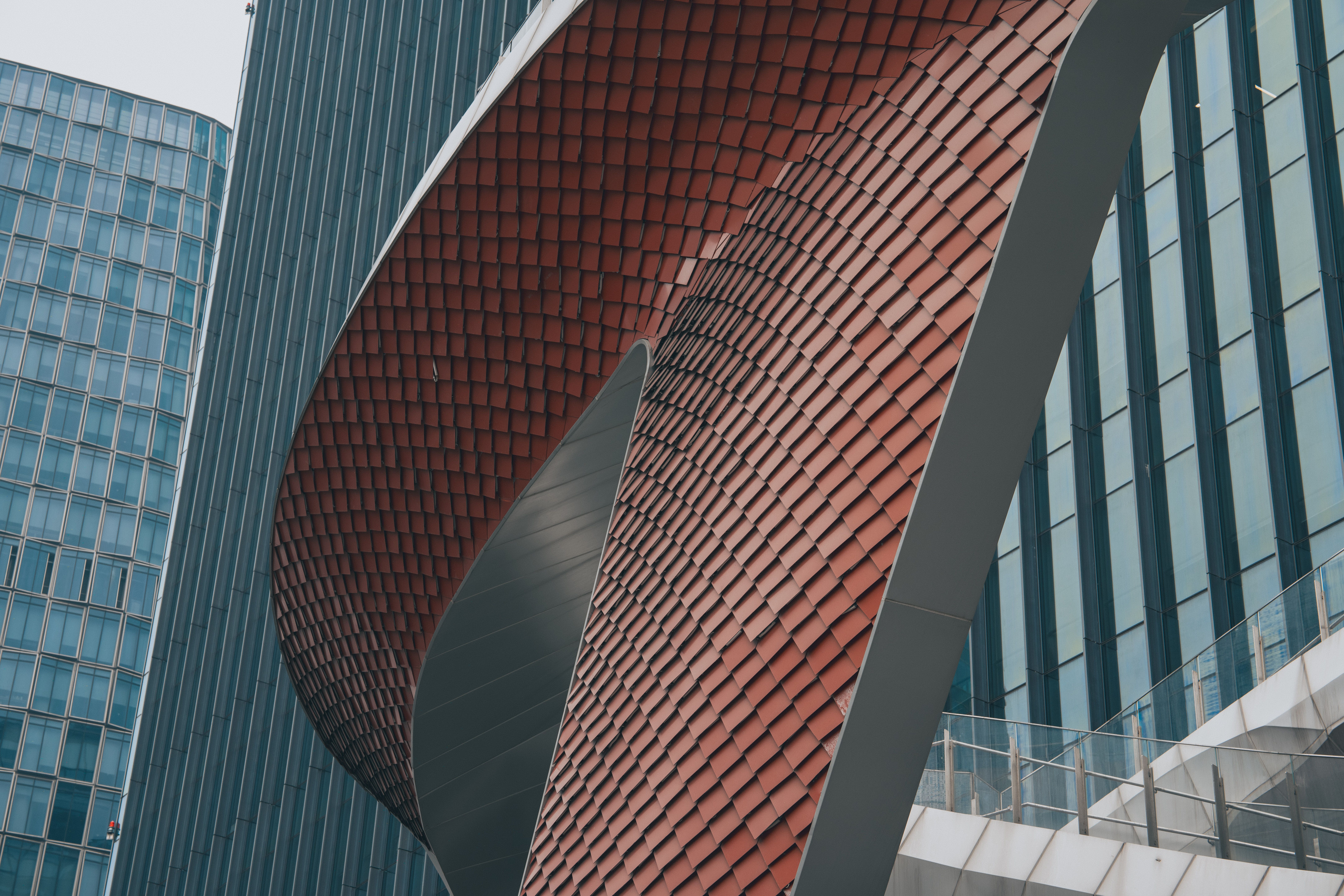 Modern Architectural Facade with Red and Glass Elements · Free Stock Photo
