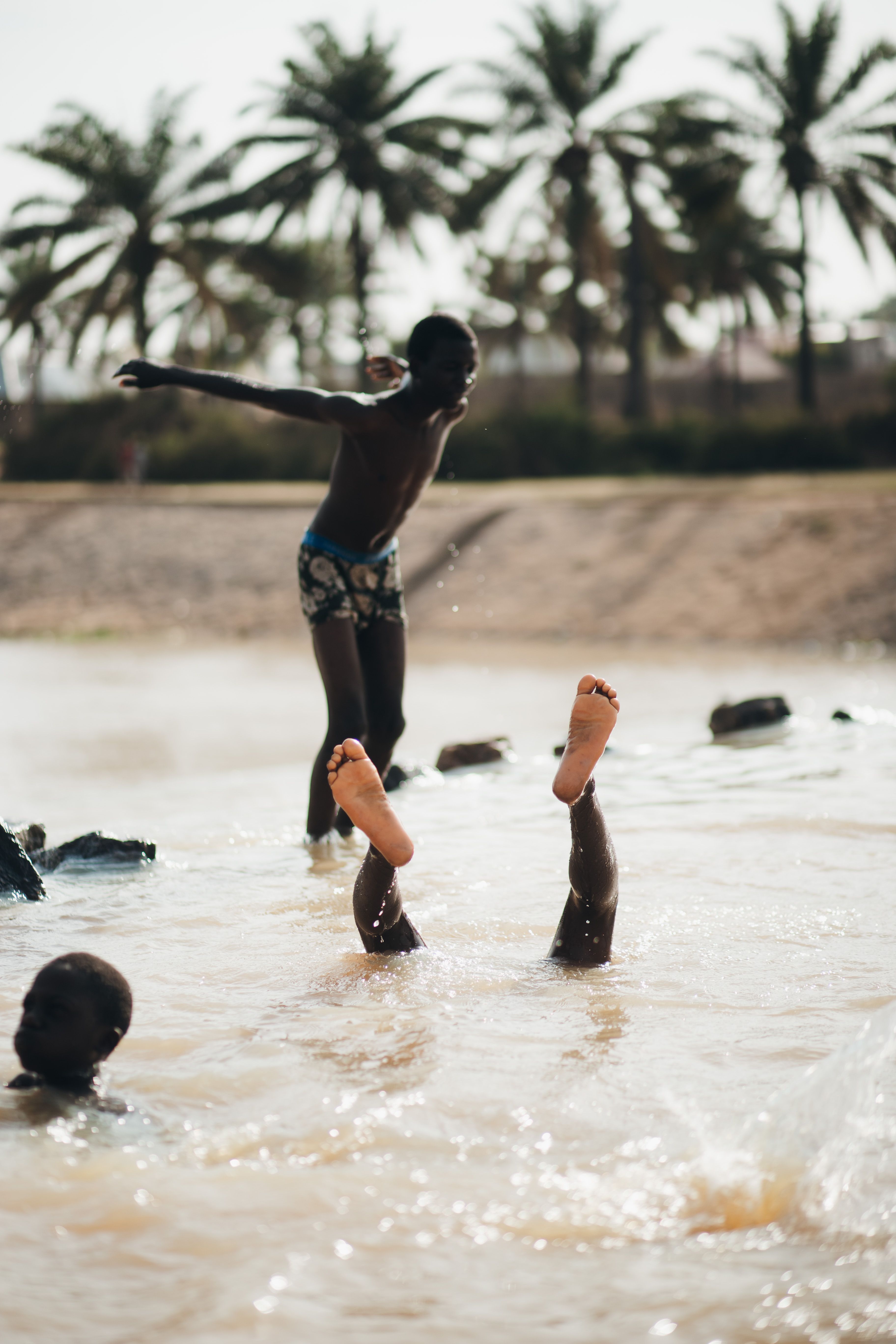 Children Playing in Tropical Beach Waters · Free Stock Photo