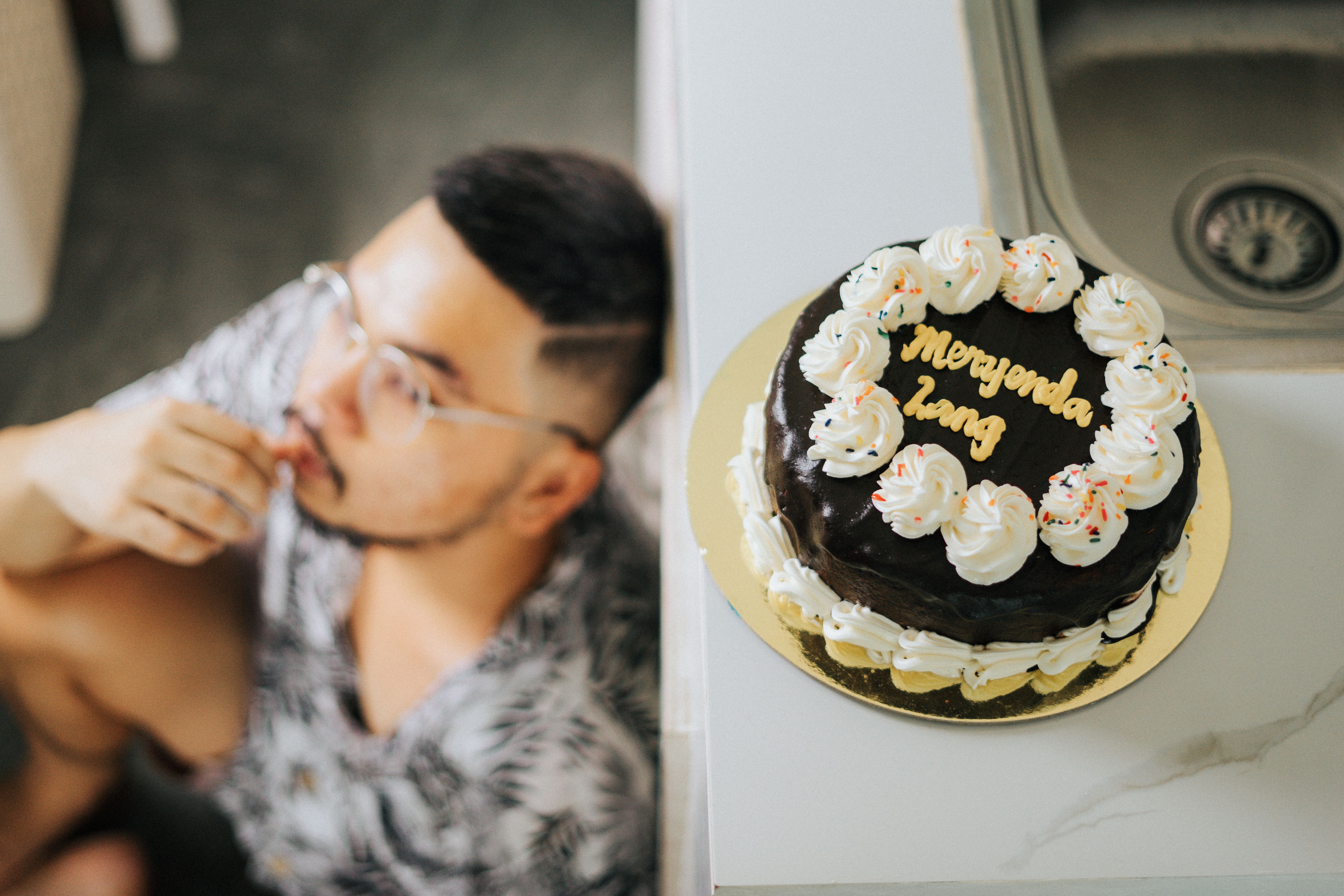 Chocolate Cake Celebration with Man in Kitchen · Free Stock Photo