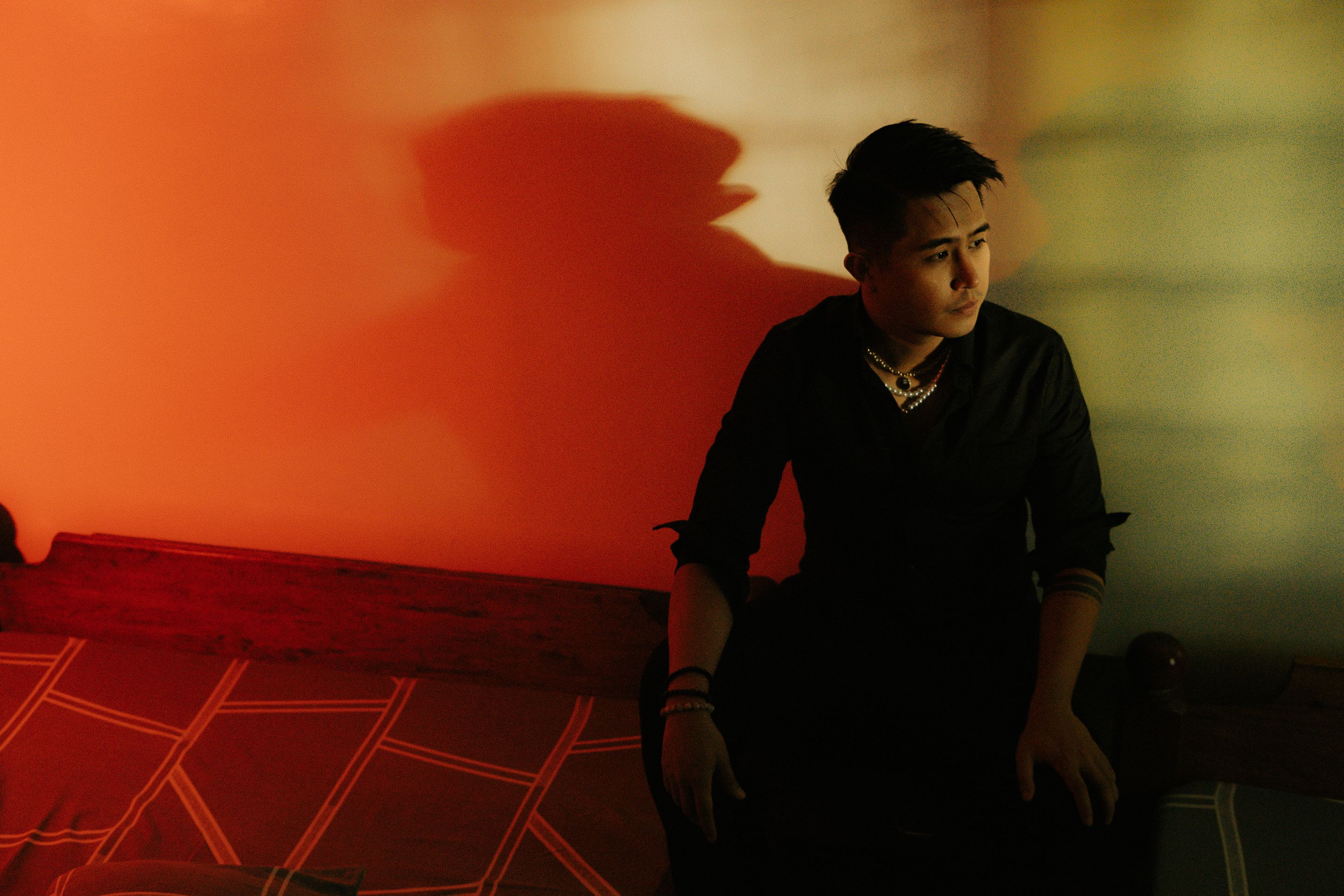 Moody Portrait of Young Man in Dimly Lit Room · Free Stock Photo