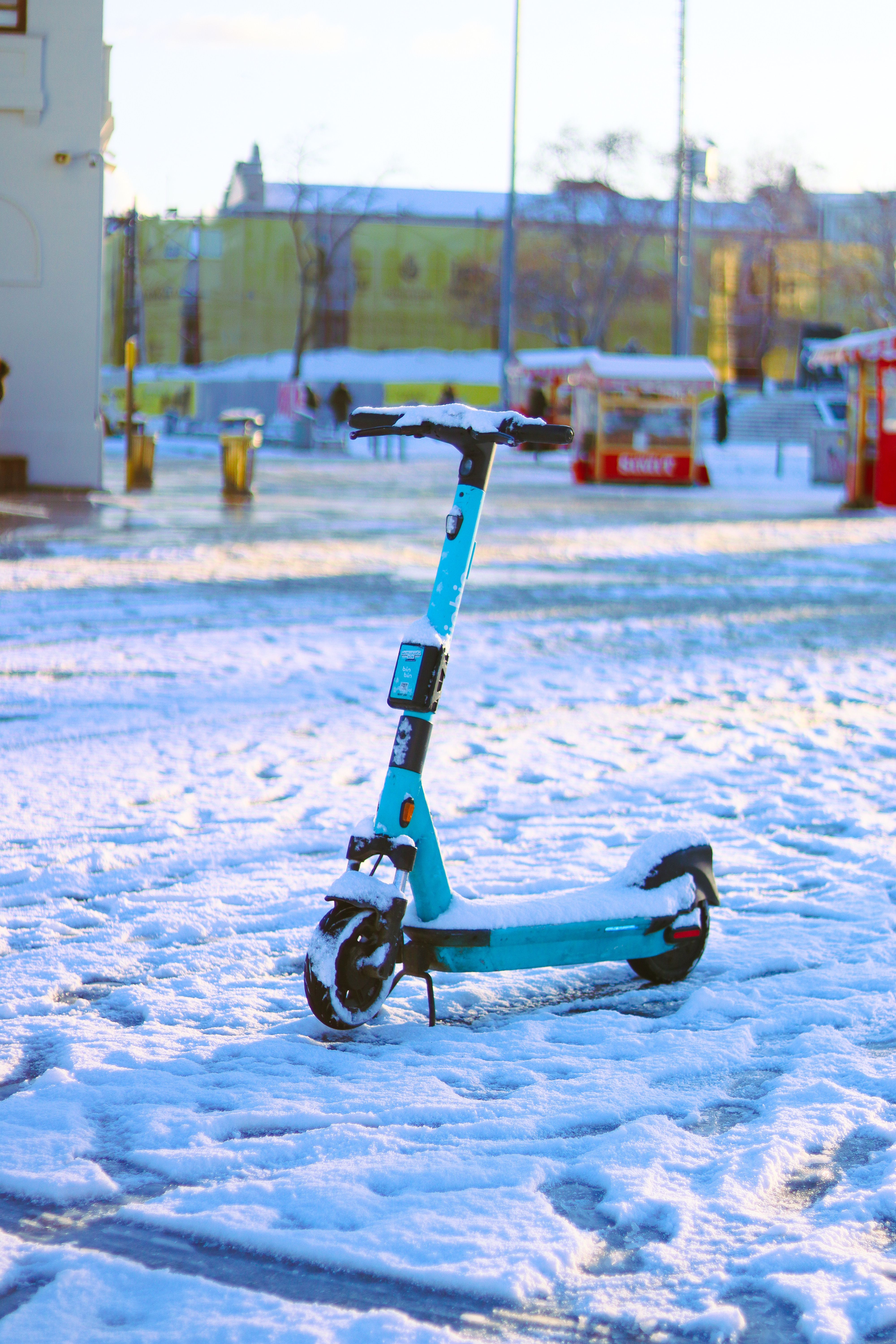 Electric Scooter Covered in Snow on Street · Free Stock Photo