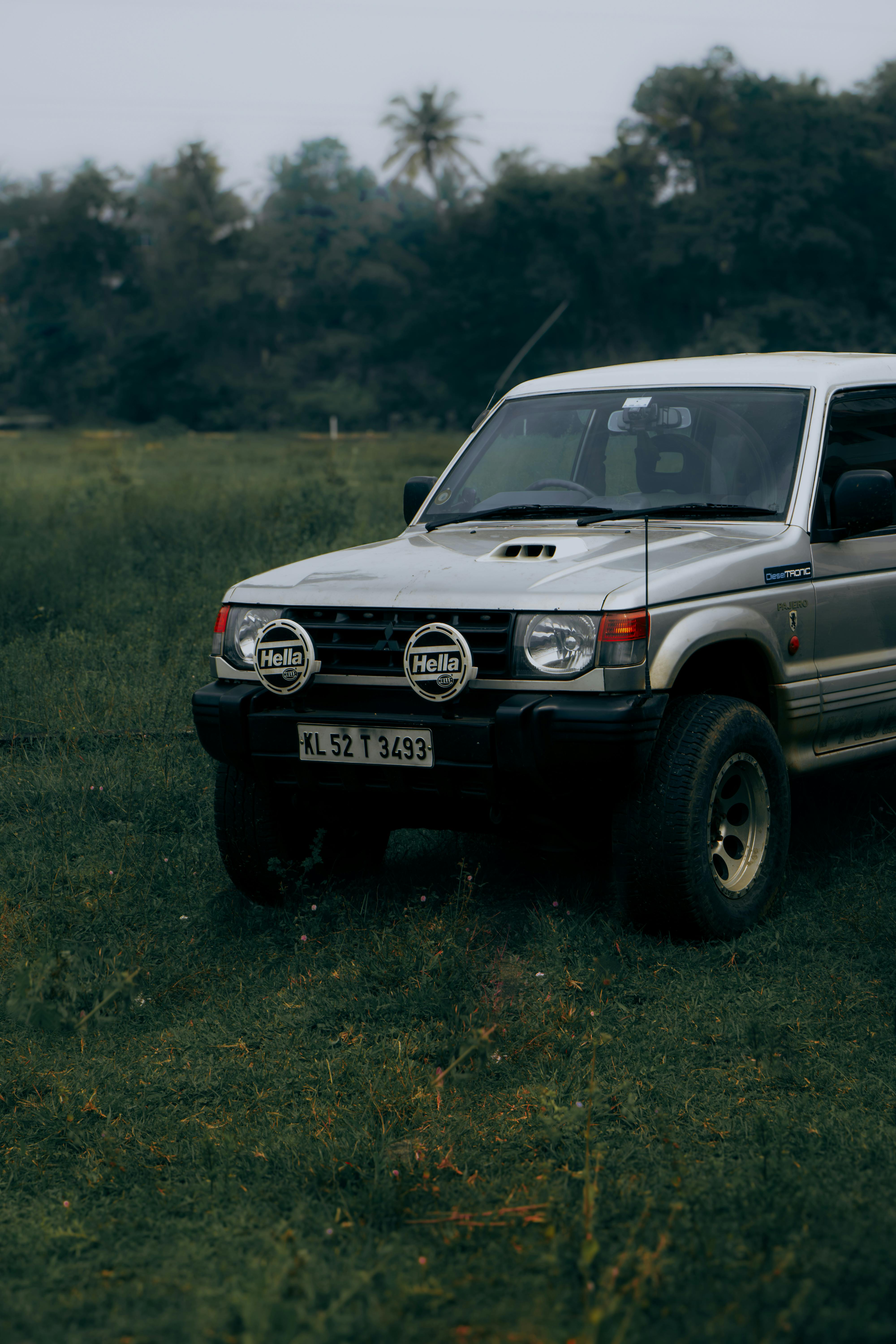 Off-Road Vehicle in Lush Green Landscape · Free Stock Photo