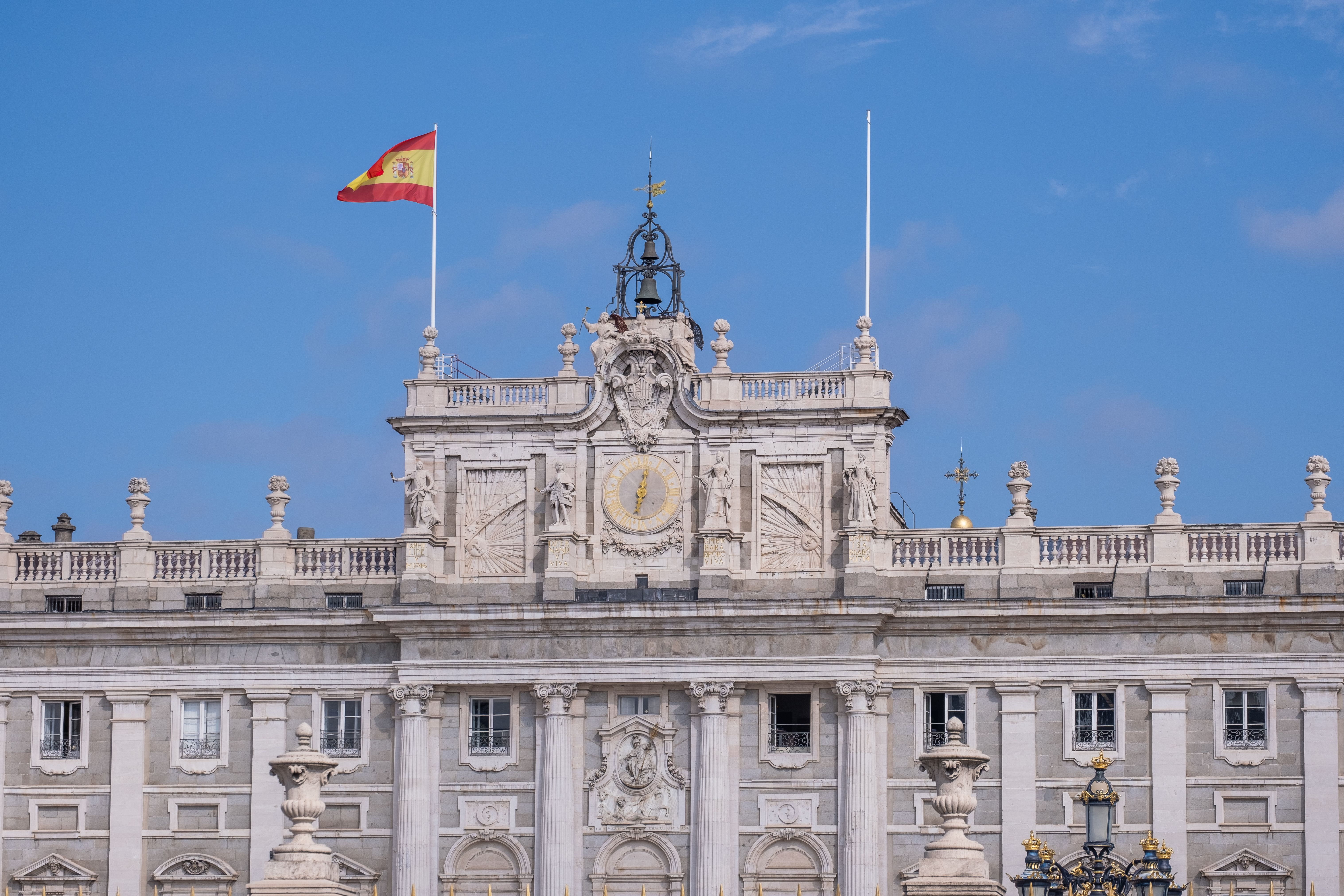 Low Angle Shot of a Traditional Building Exterior and a Spanish Flag ...