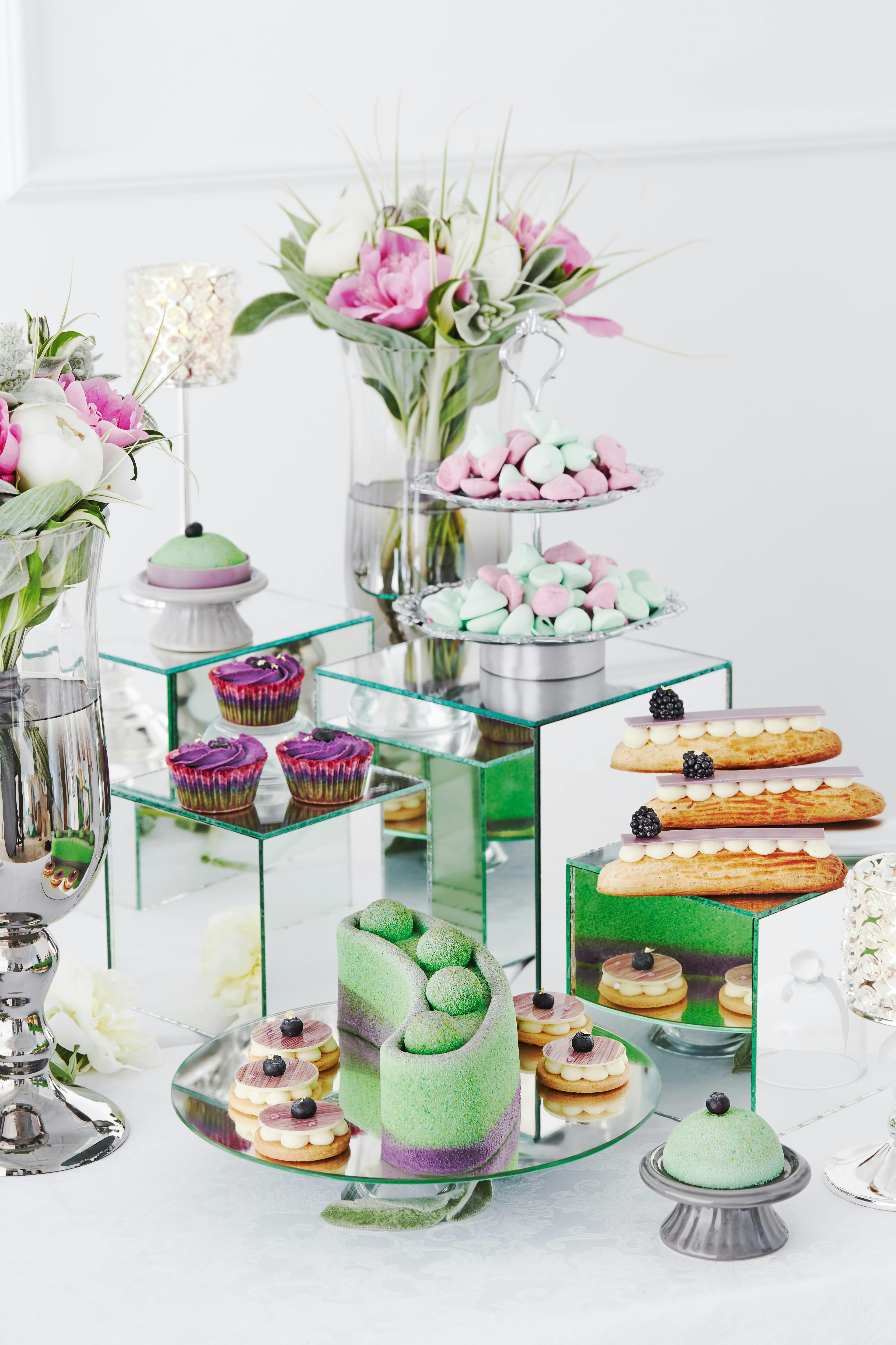 Elegant Dessert Table with Pastel Sweets · Free Stock Photo
