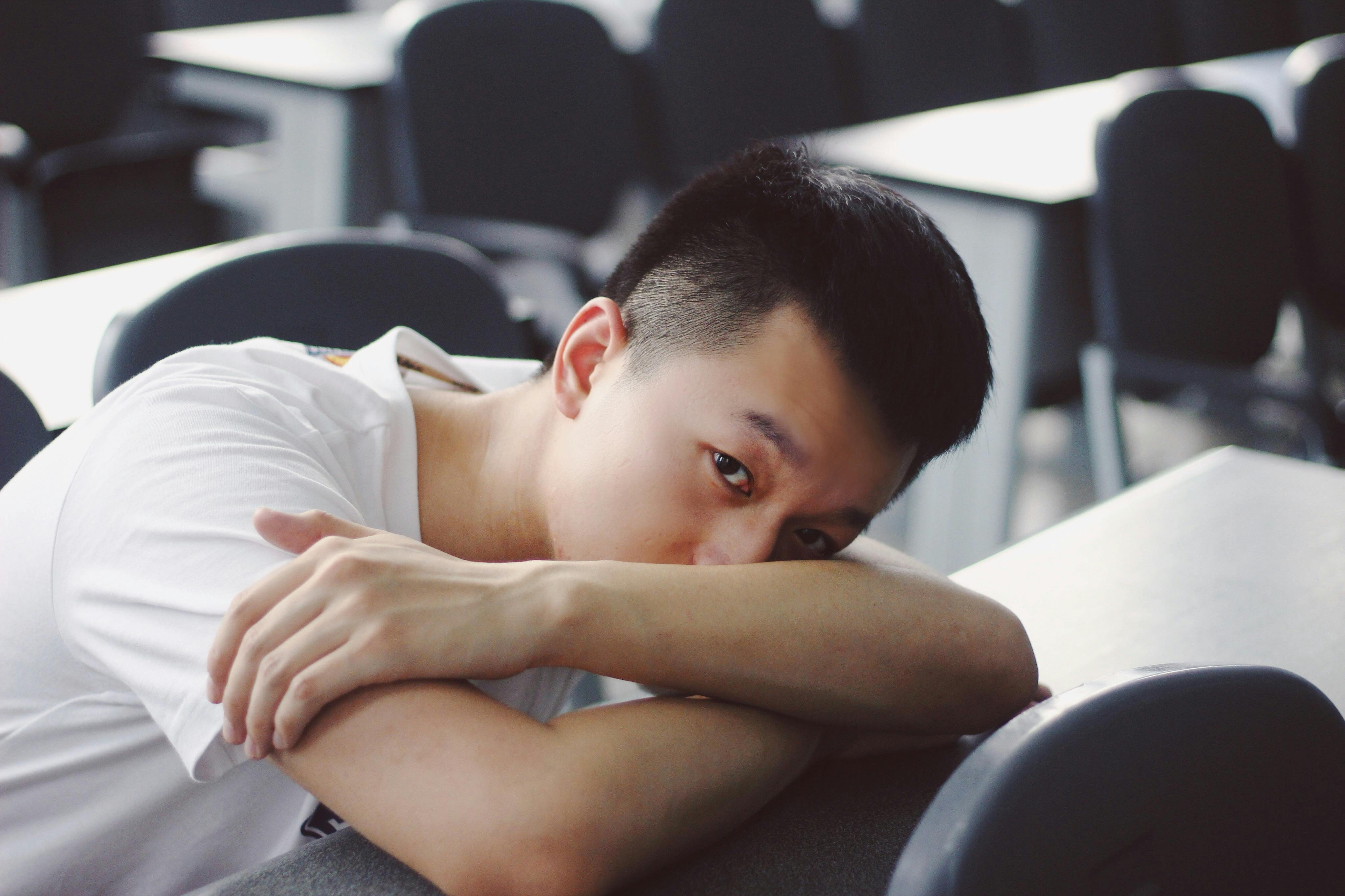 Photo Of A Man Leaning On A Table · Free Stock Photo