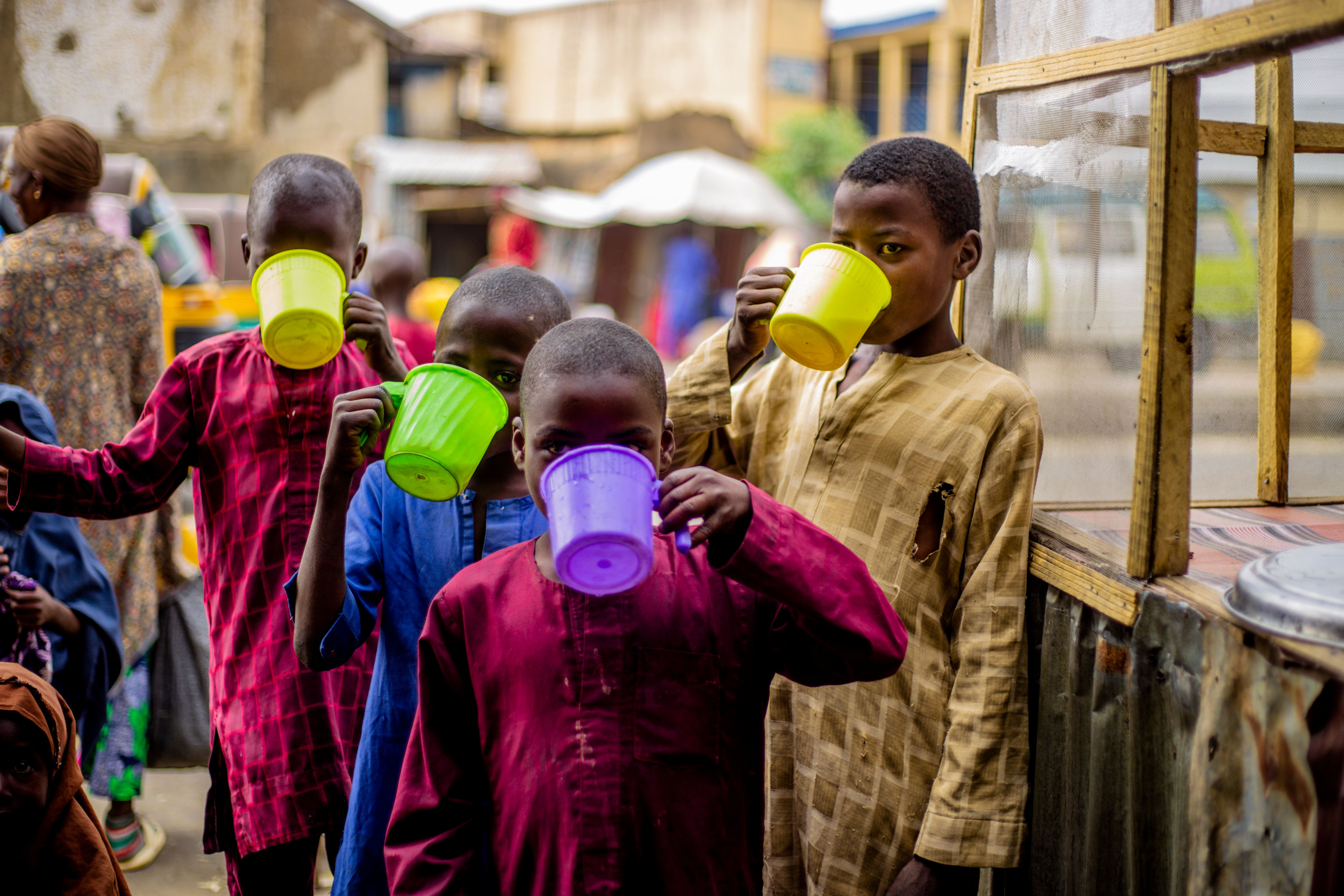 Children Drinking Refreshing Beverages Outdoors · Free Stock Photo