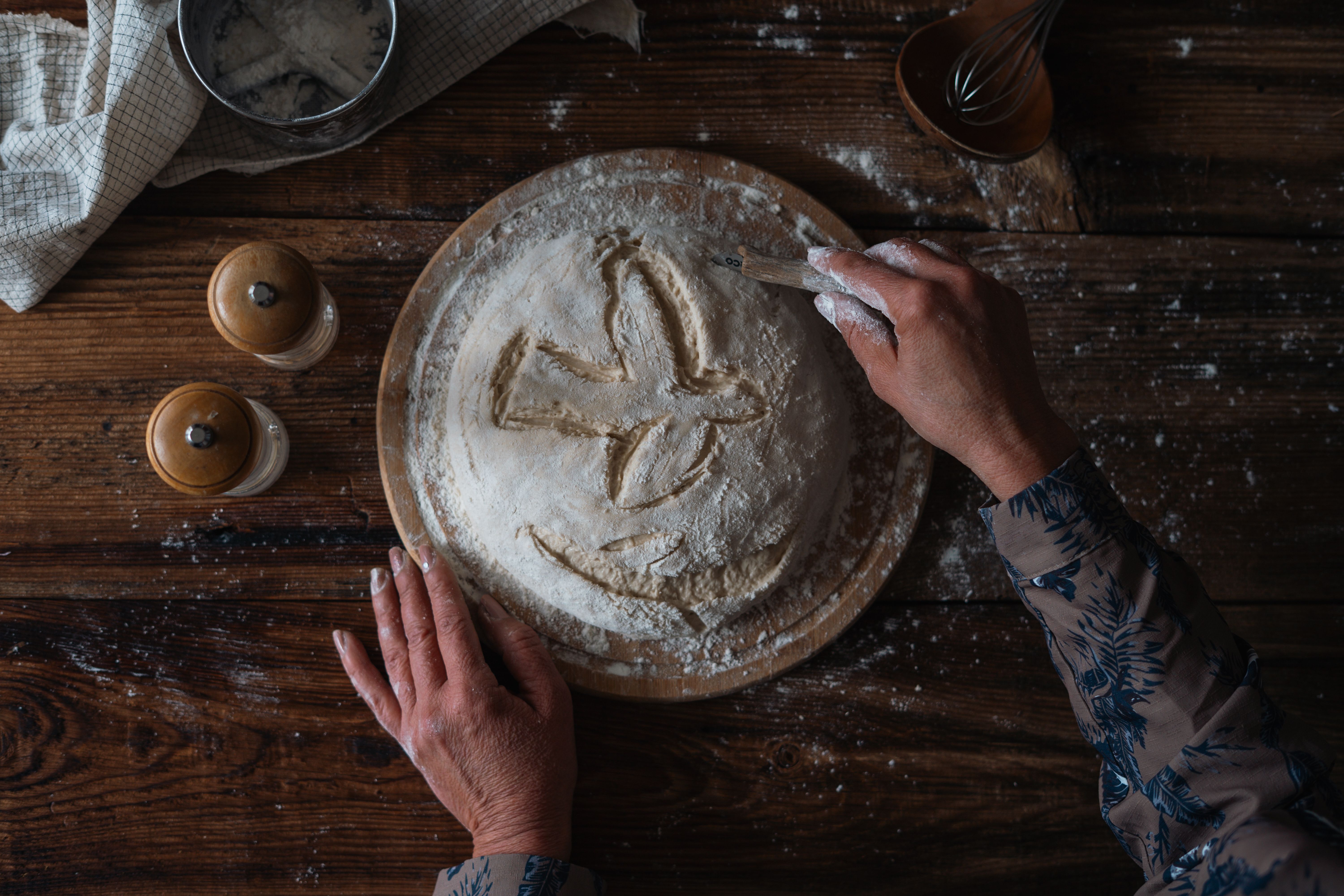 Artistic Bread Preparation on Rustic Wooden Table · Free Stock Photo