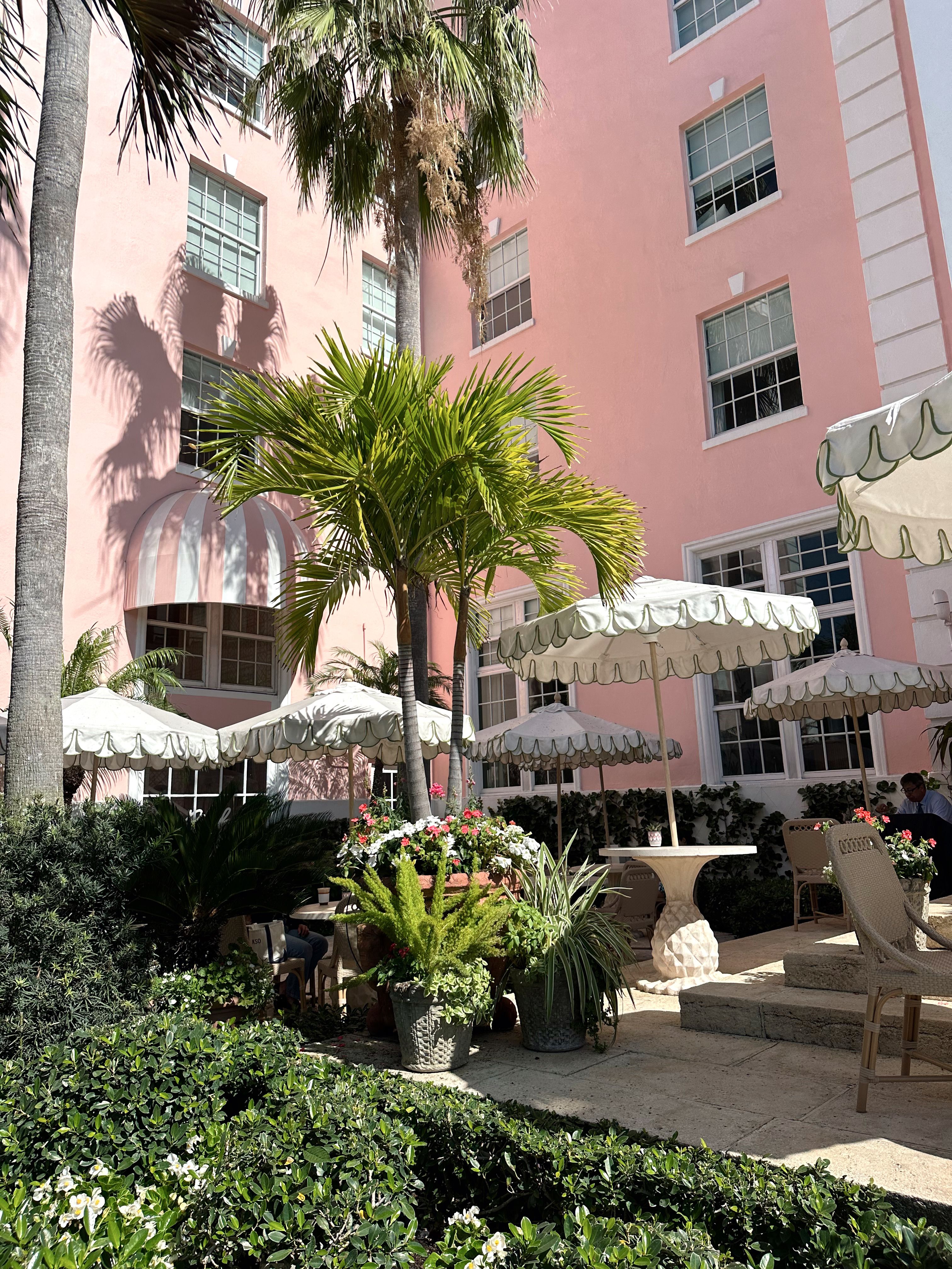Tropical Courtyard at Pink Hotel Exterior · Free Stock Photo