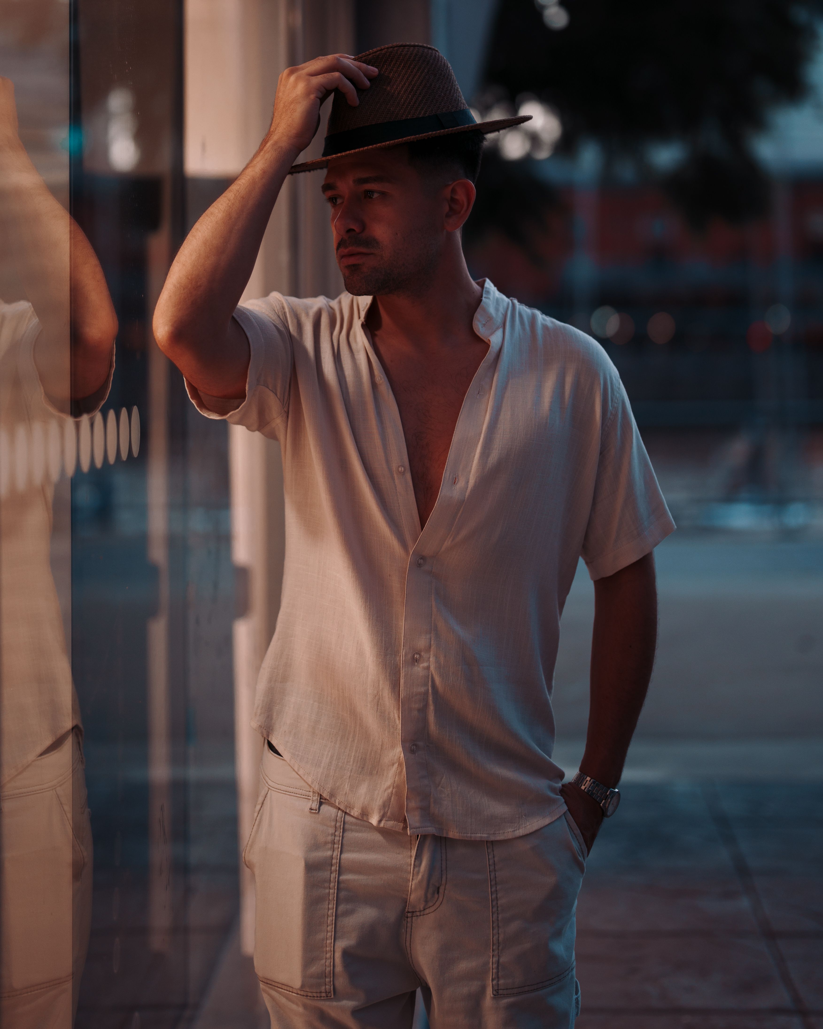 Stylish Man with Hat Reflects at Dusk in Buenos Aires · Free Stock Photo