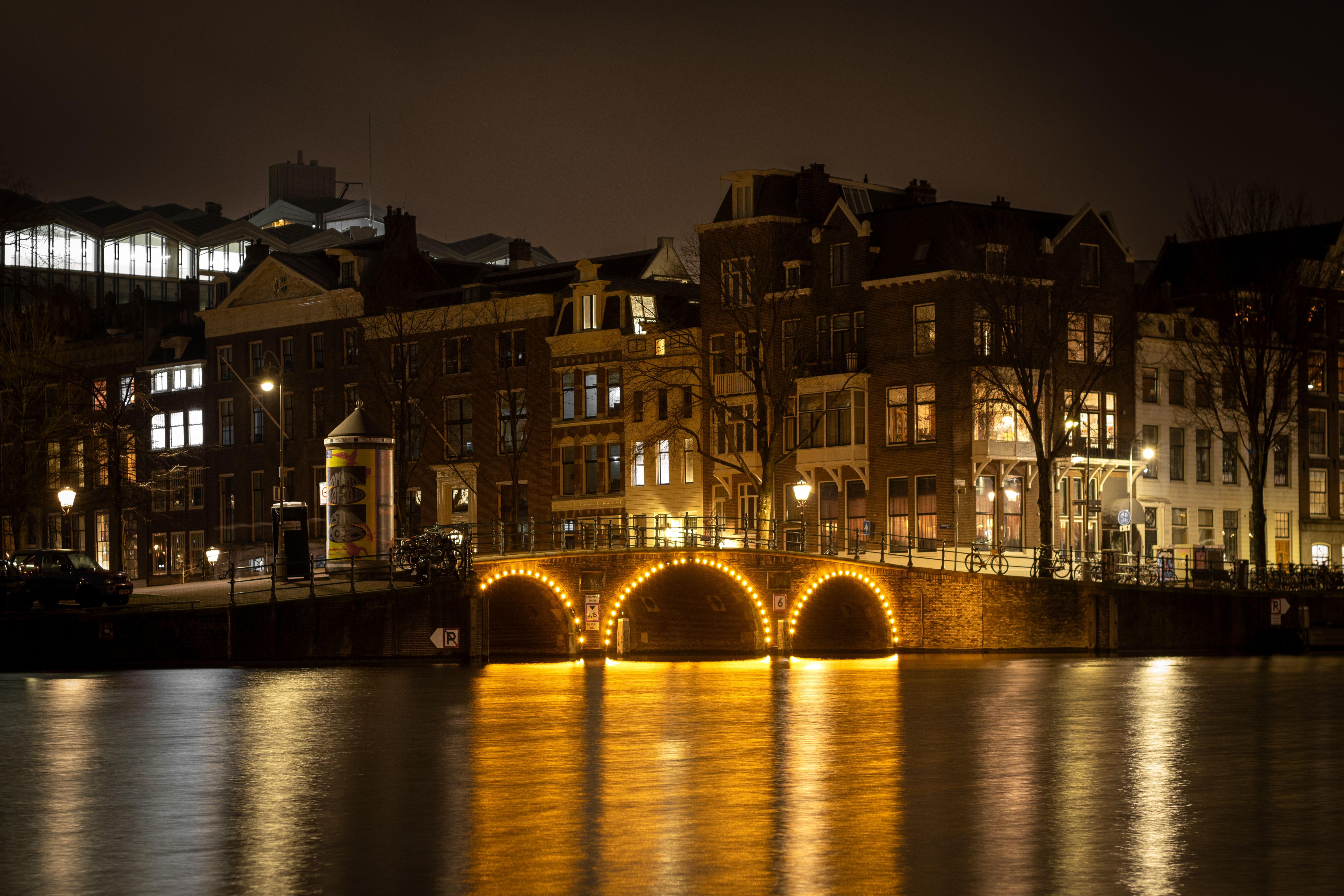 Illuminated Canal Bridge in Amsterdam at Night · Free Stock Photo
