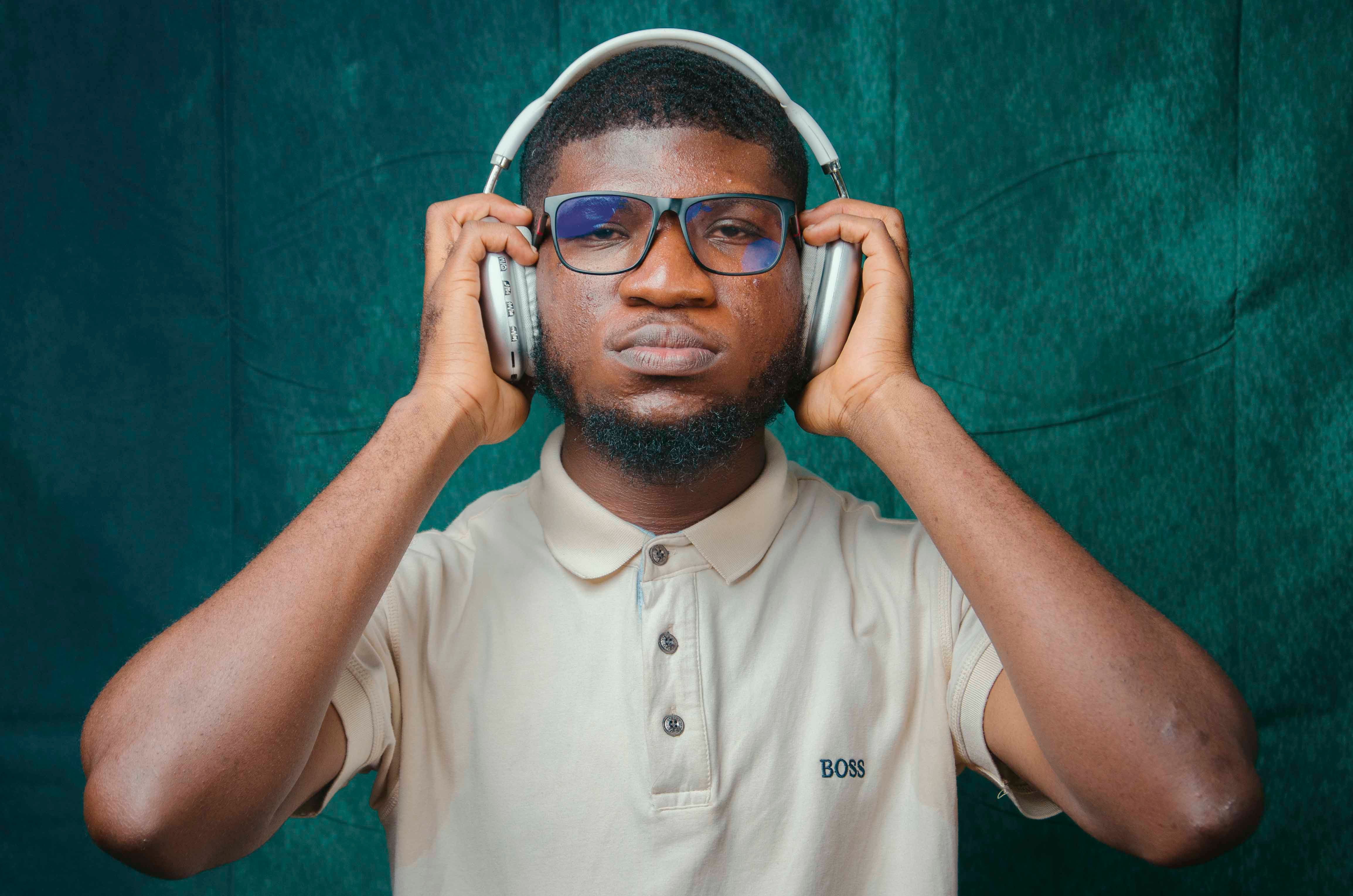 Young Man Wearing Headphones in Accra Studio · Free Stock Photo