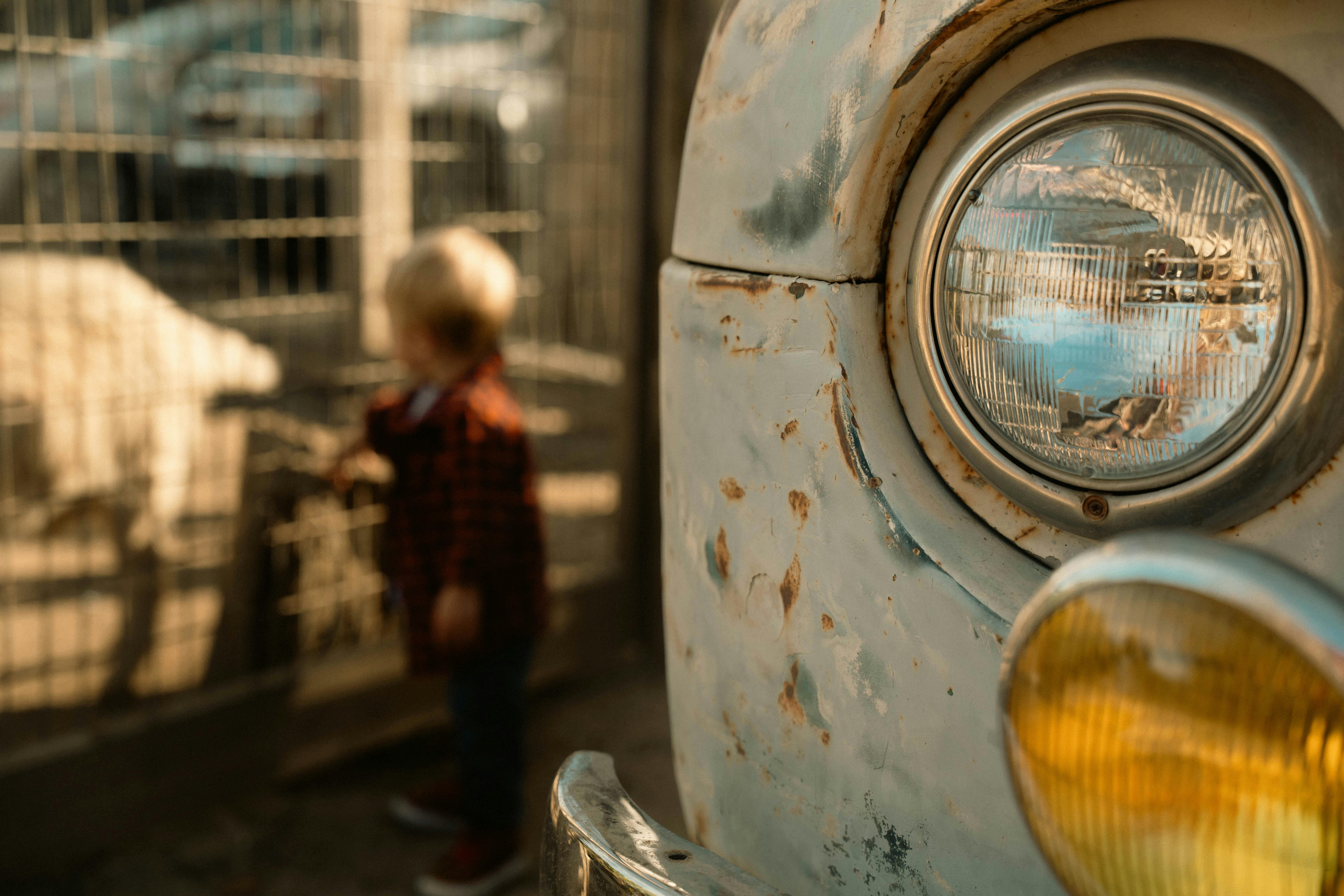 Rustic Car with Child at Zoo Fence · Free Stock Photo