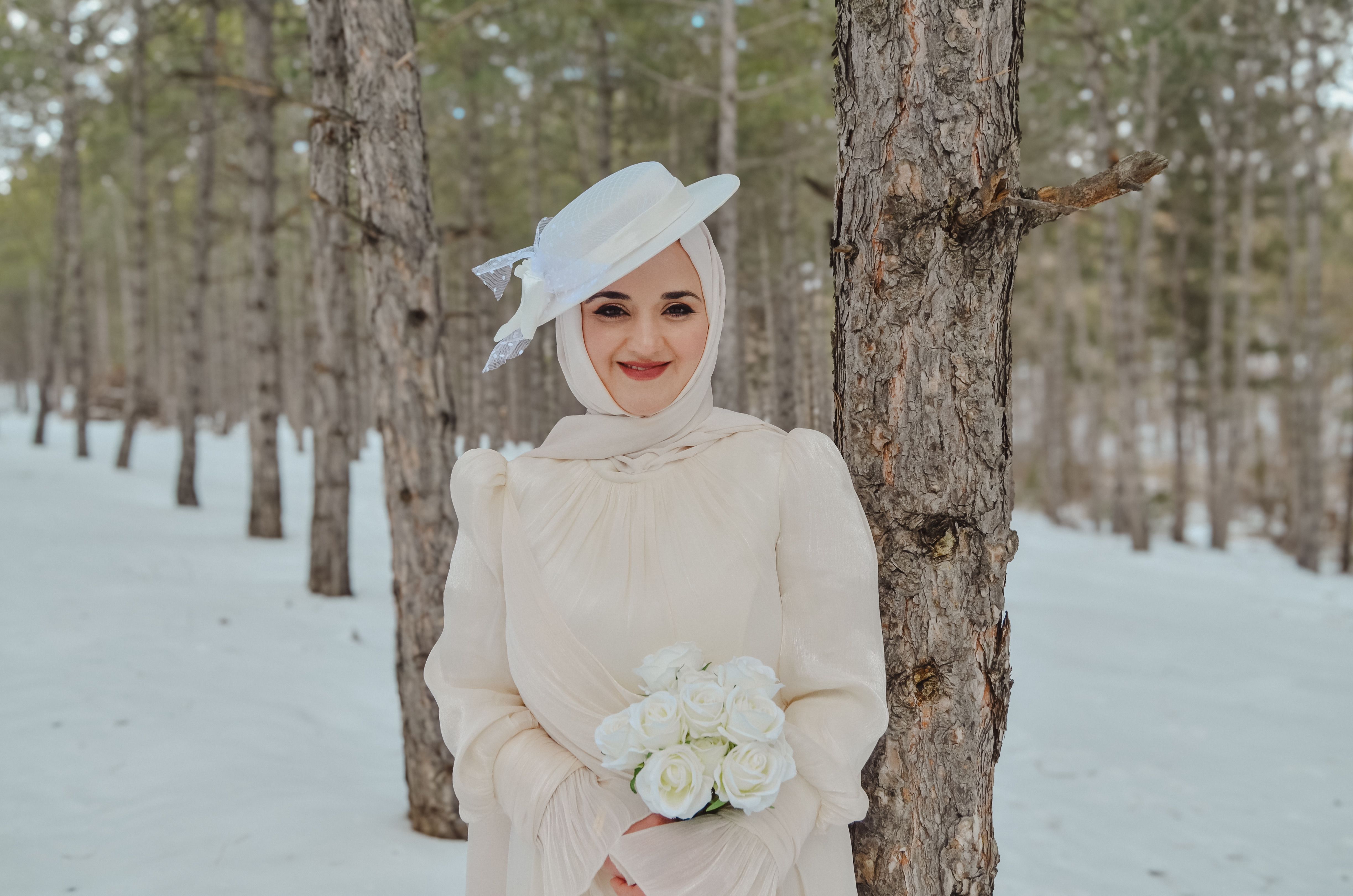 Elegant Winter Bride in Snowy Forest Setting · Free Stock Photo
