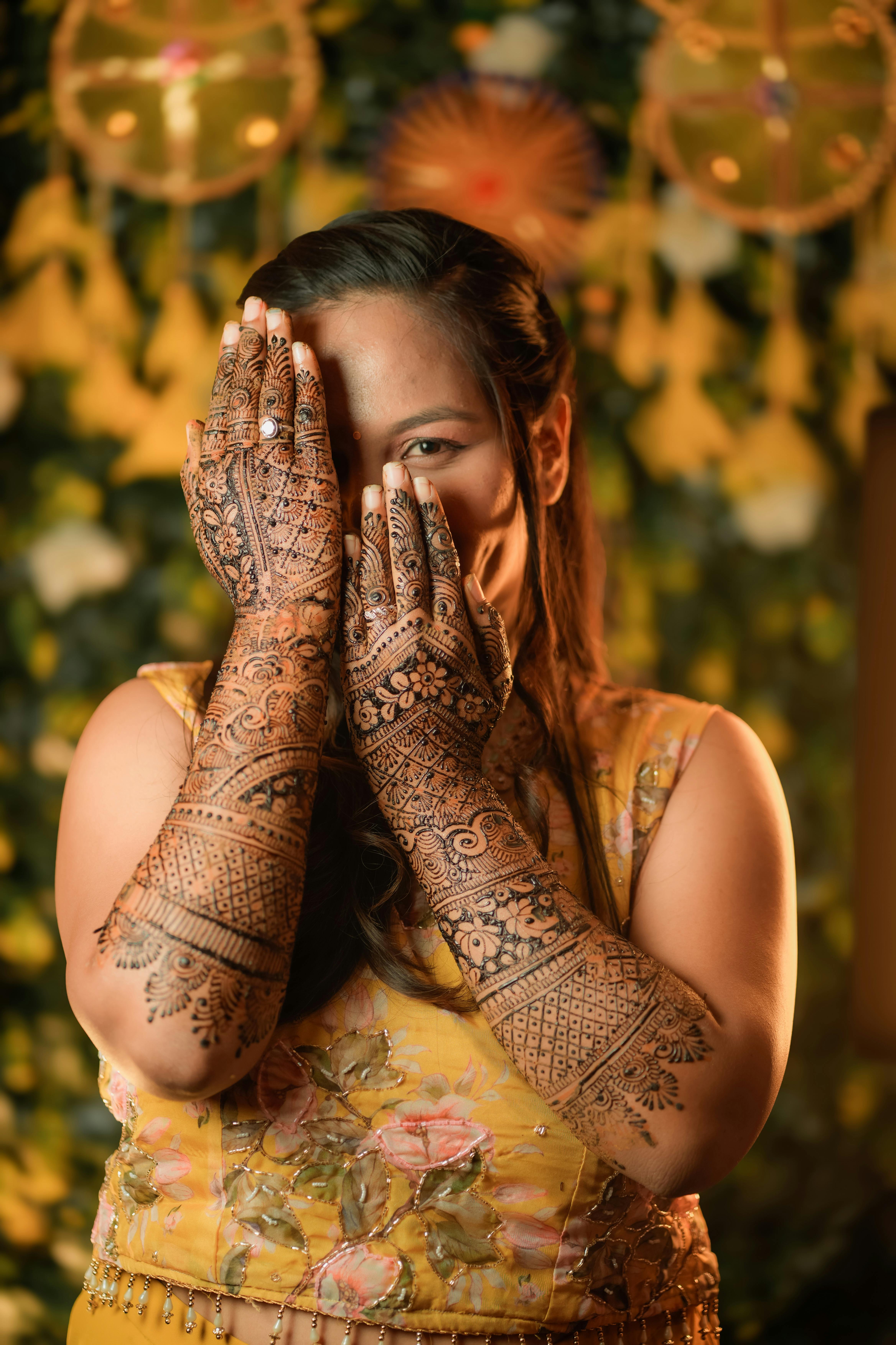 Henna Adorned Woman Celebrating Indoors · Free Stock Photo