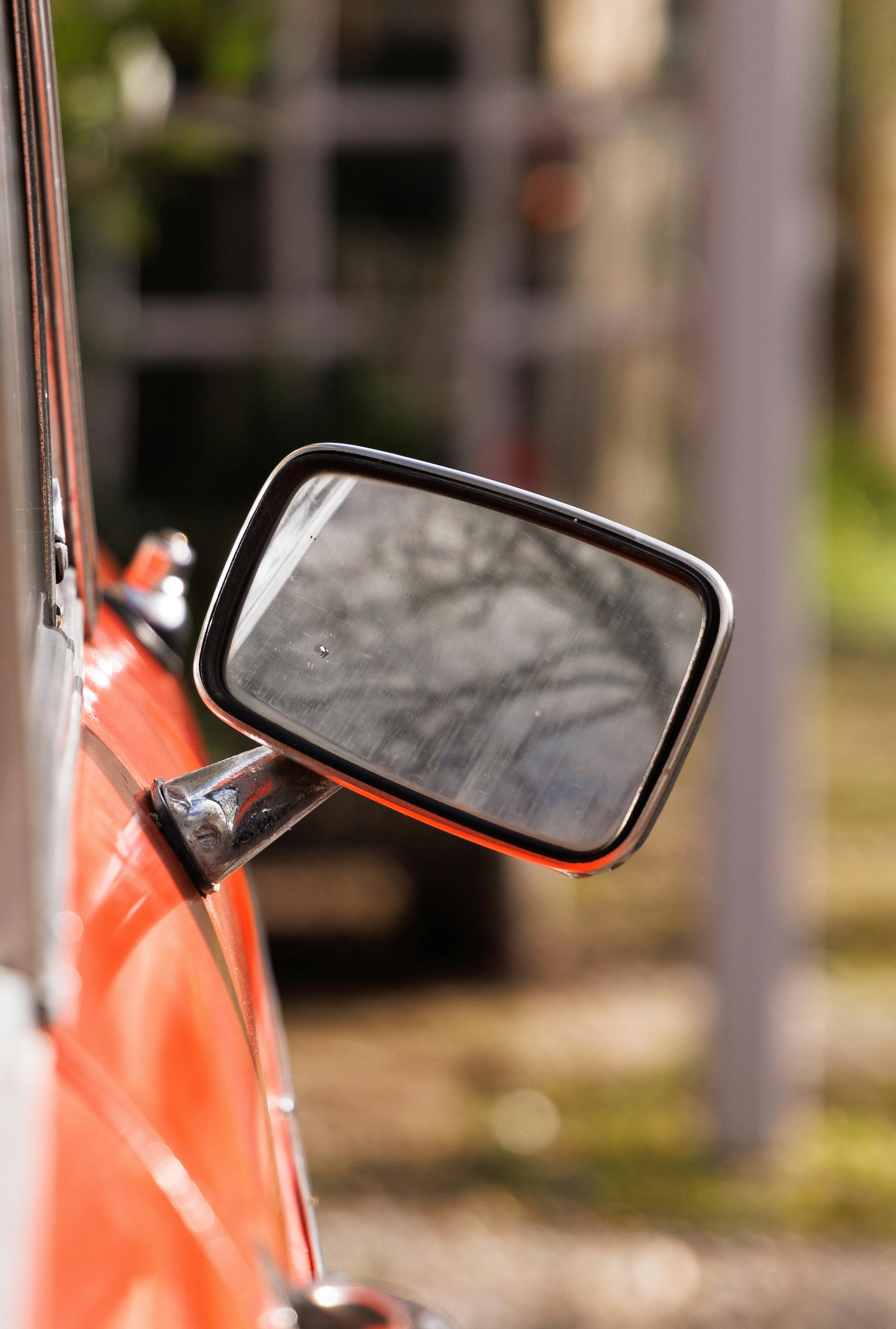 Close-Up of Retro Red Car Side Mirror · Free Stock Photo