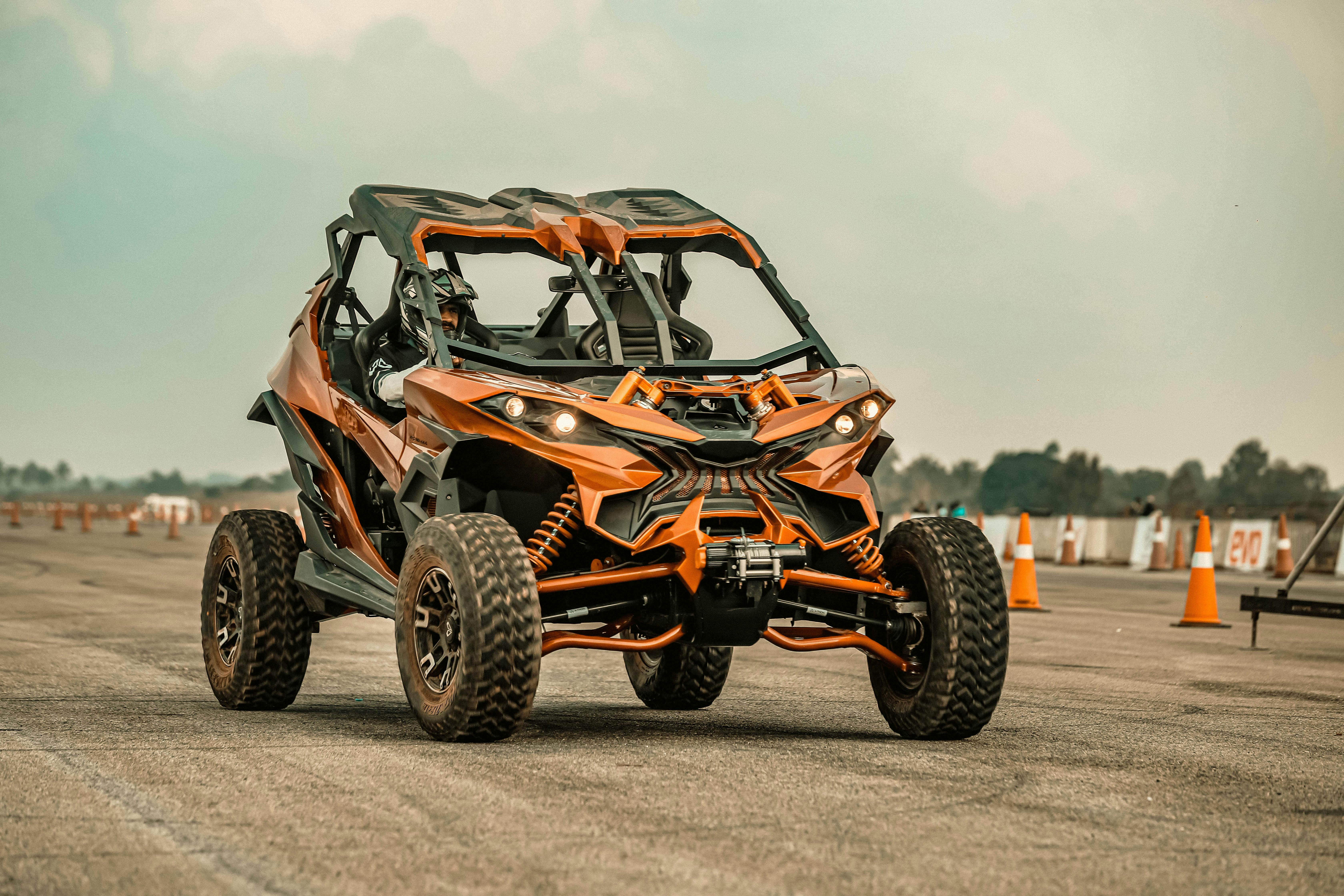 Dynamic Orange Off-Road Buggy on Asphalt Track · Free Stock Photo