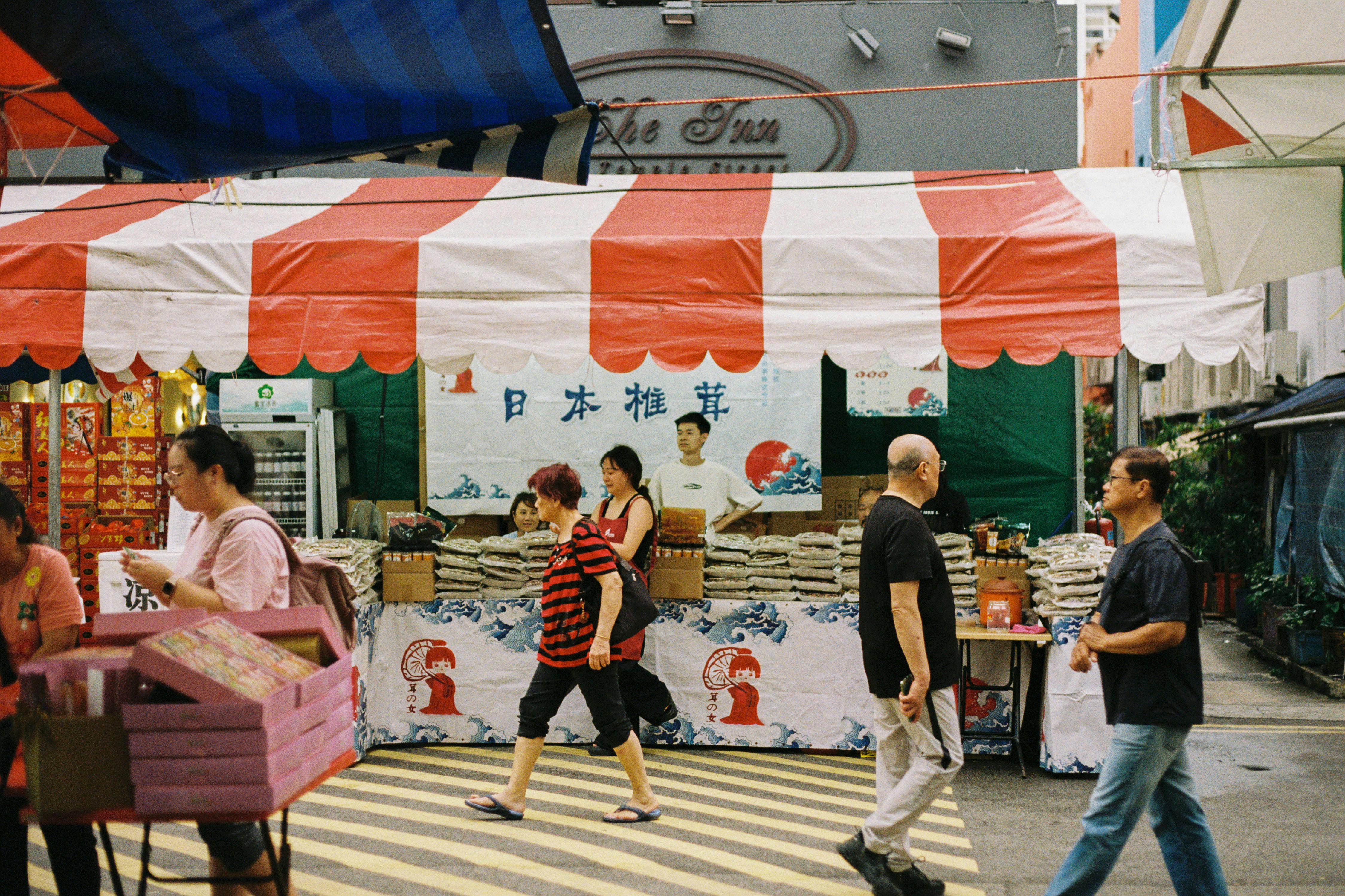 Vibrant Street Market Scene in Singapore · Free Stock Photo