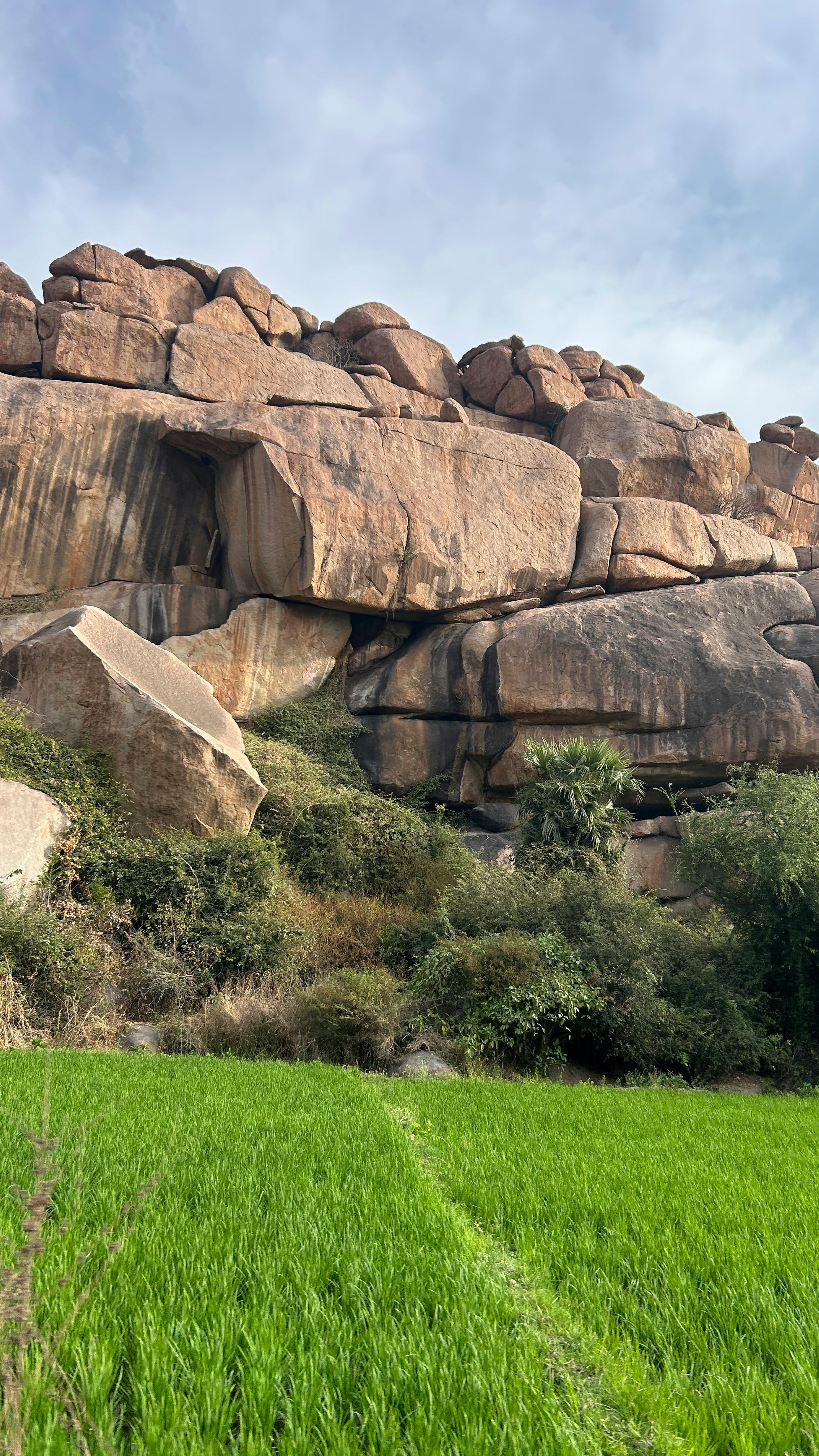 Majestic Boulder Formation in Lush Green Landscape · Free Stock Photo